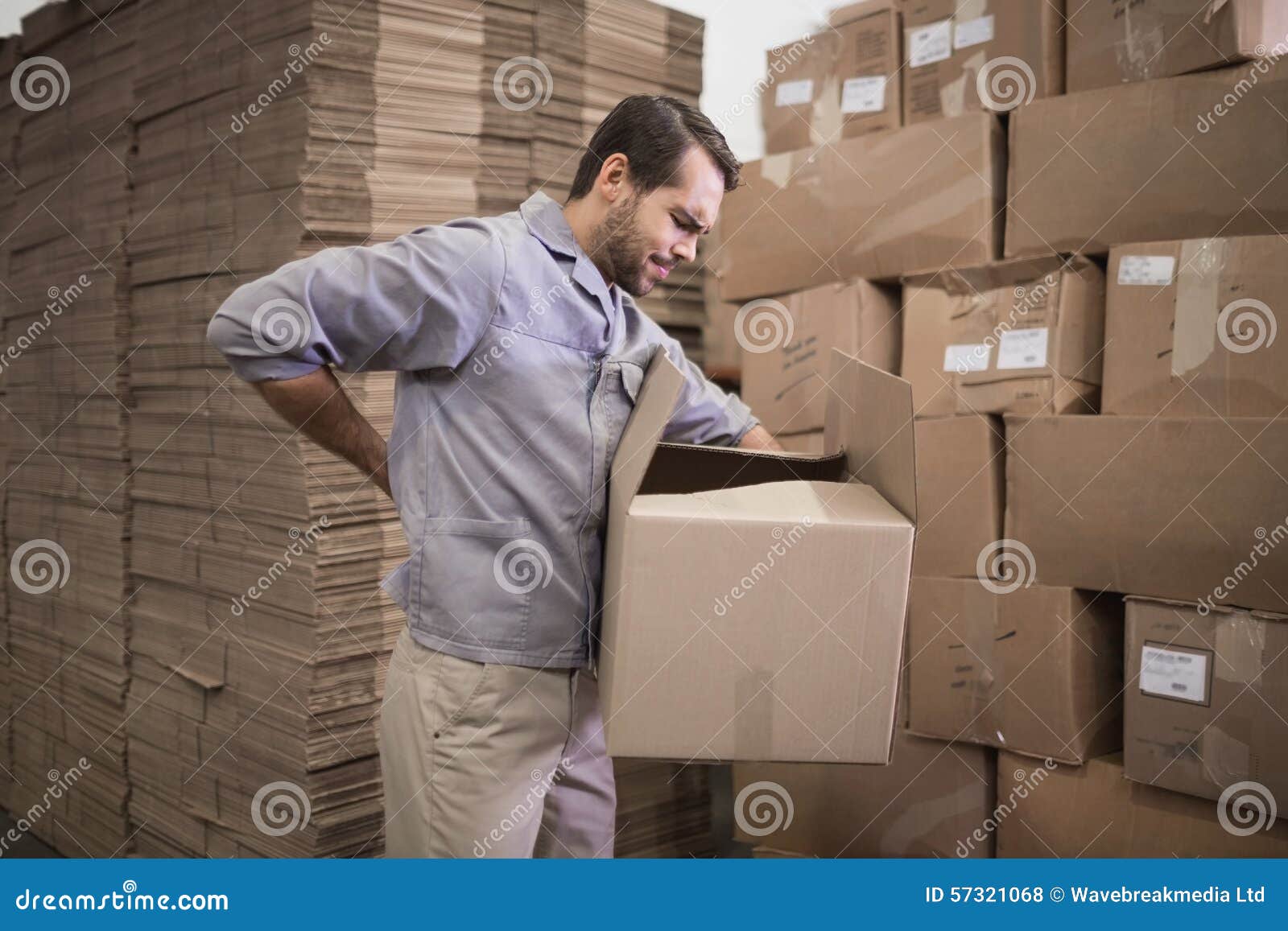 Worker Carrying Box in Warehouse Stock Photo - Image of adult, goods ...