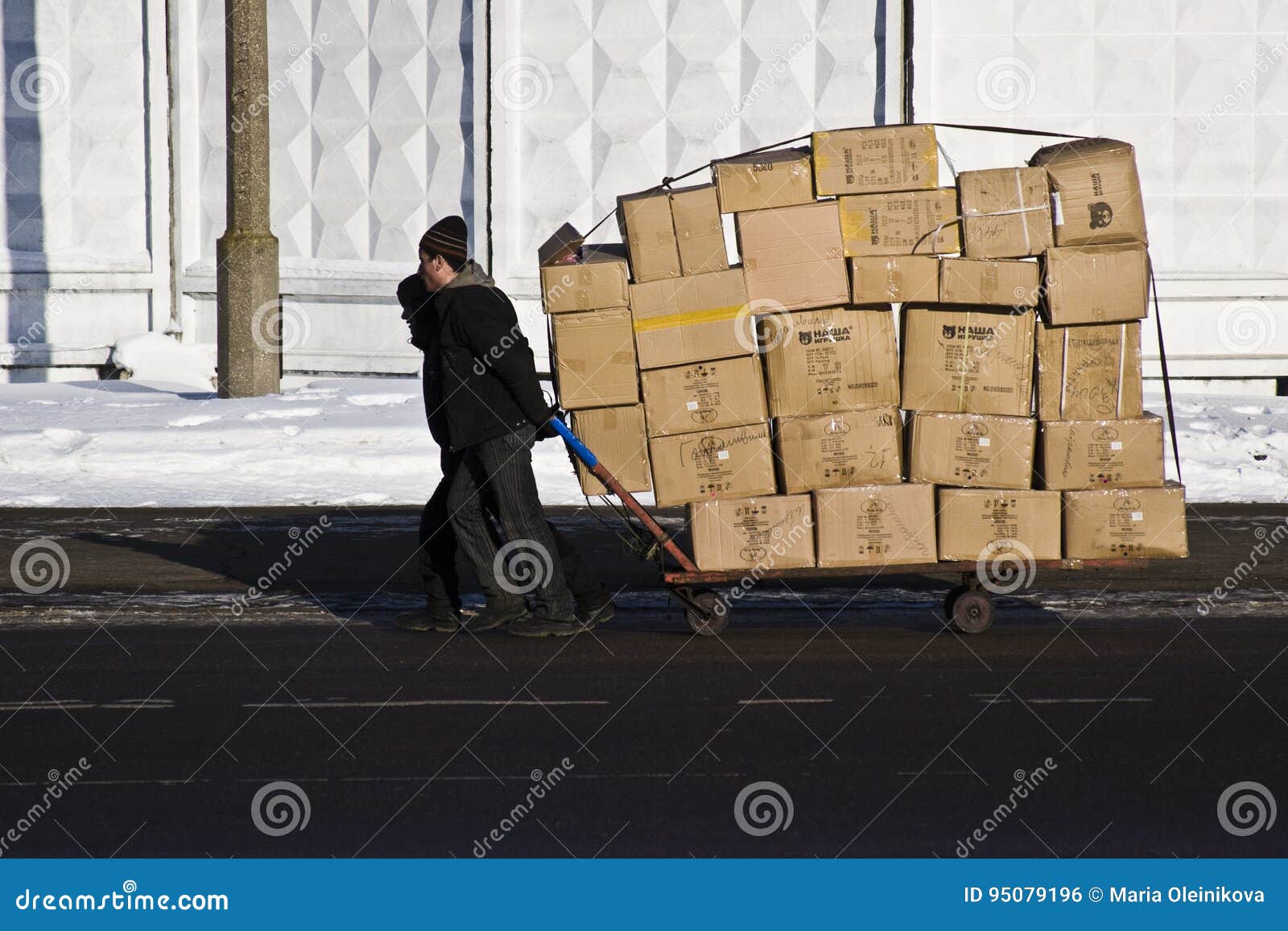 Worker is Carrying a Cart with Boxes Editorial Photo - Image of ...