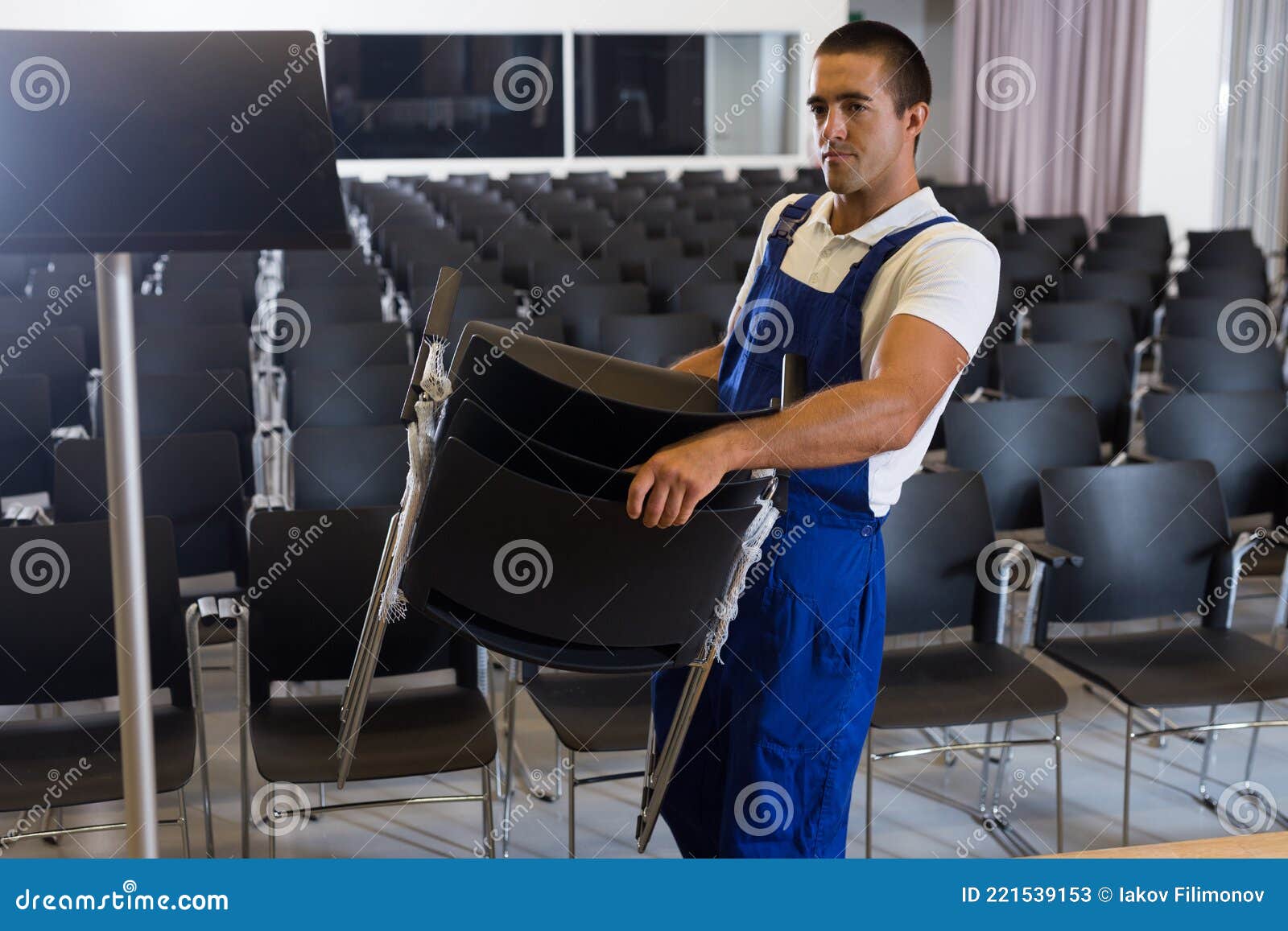 Worker Carrying Chairs in Empty Room Stock Image - Image of modern ...