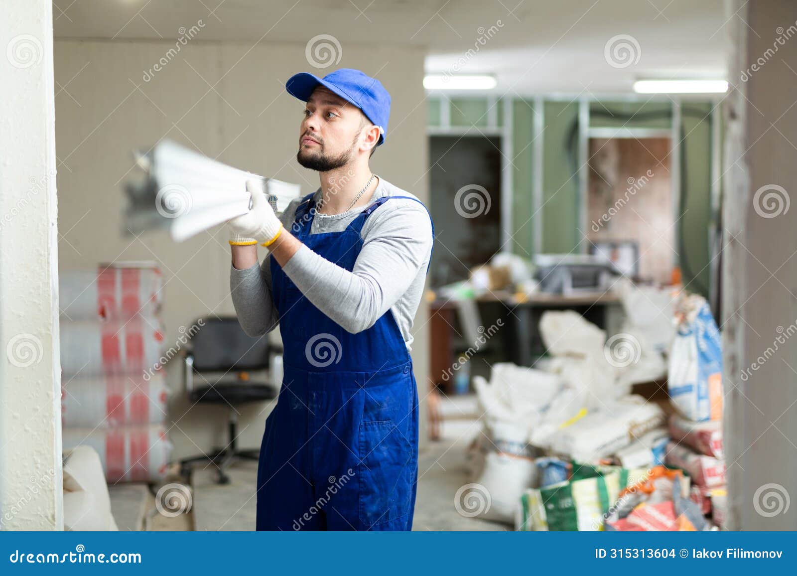 Worker Carrying Construction Materials at Renovating Object Stock Photo ...