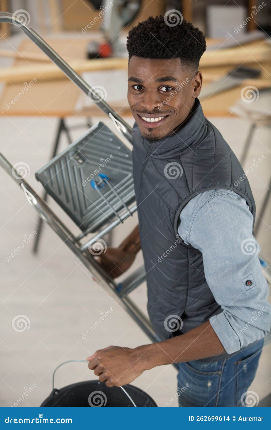 Worker Carrying Ladder at Construction Site Stock Photo - Image of ...