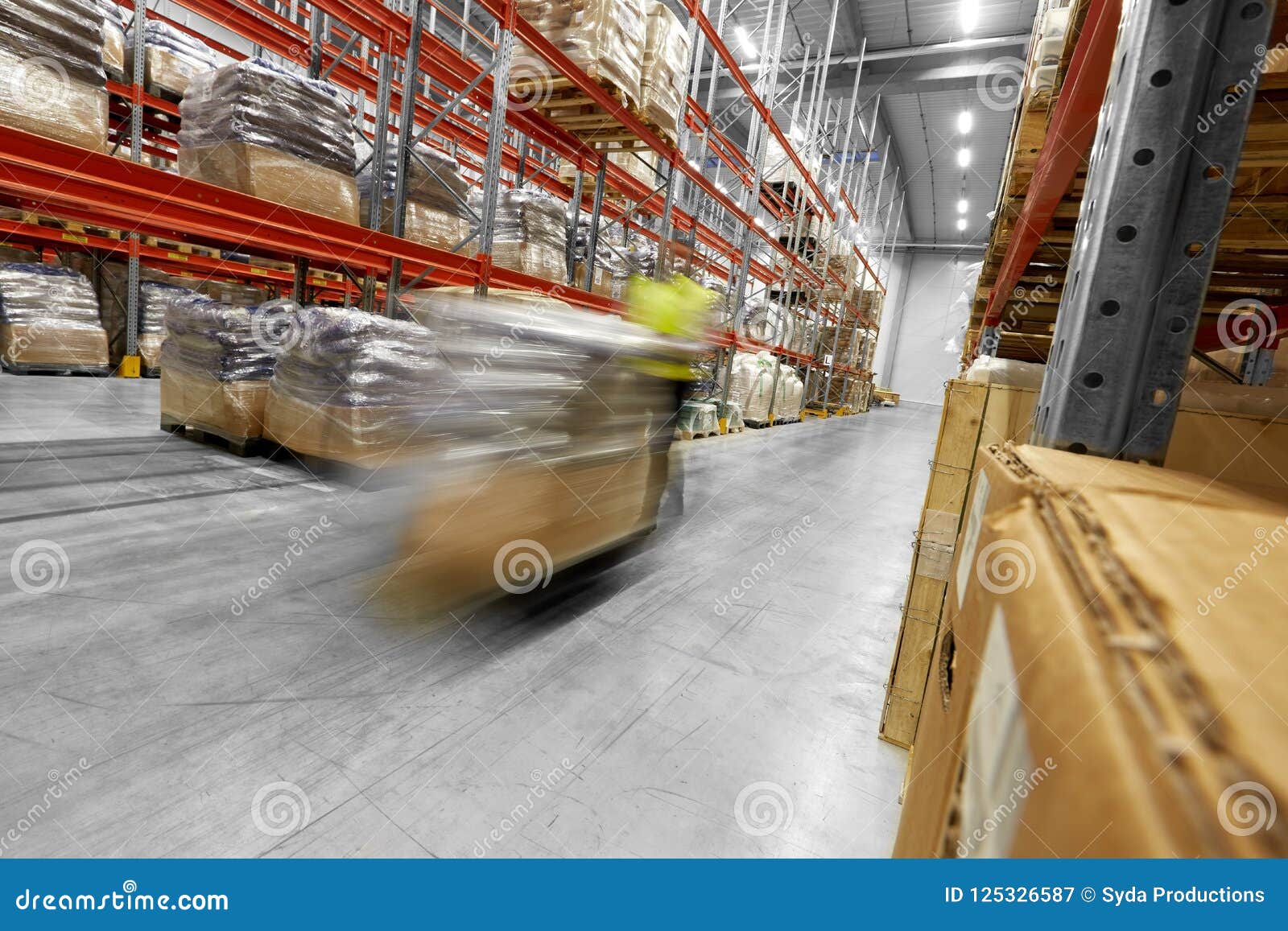 Worker Carrying Loader with Goods at Warehouse Stock Image - Image of ...