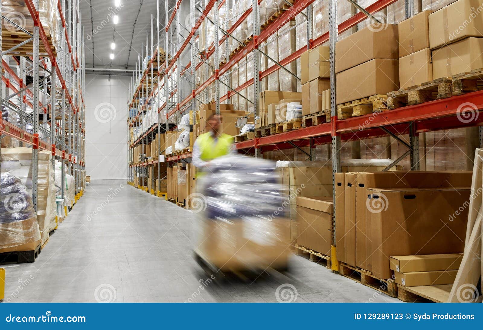 Worker Carrying Loader with Goods at Warehouse Stock Image - Image of ...