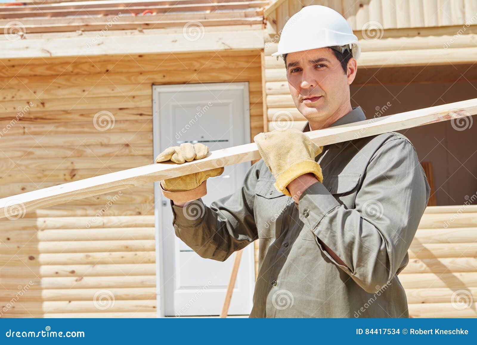 Worker Carrying Wood at Construction Site Stock Photo - Image of trade ...