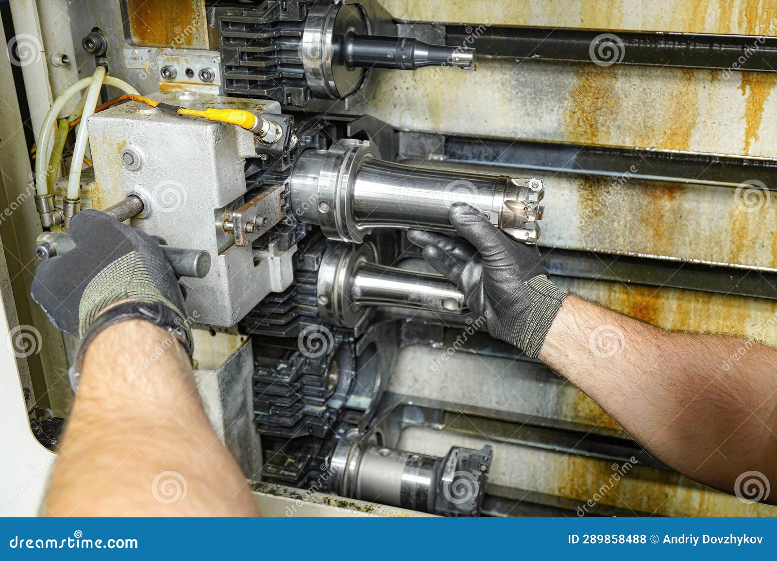 A Worker Changes a High-speed Cutter on a CNC Milling Machine Stock ...