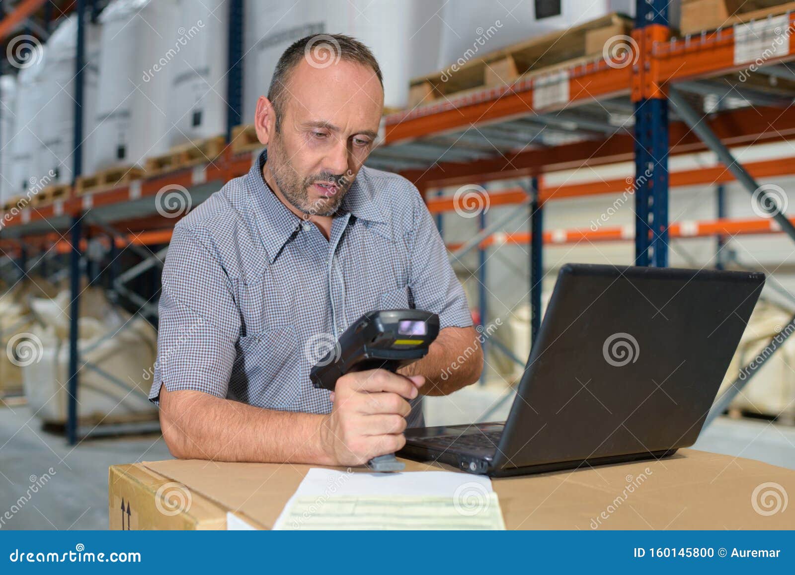Worker Checking Goods with Barcode Scanner Stock Photo - Image of ...