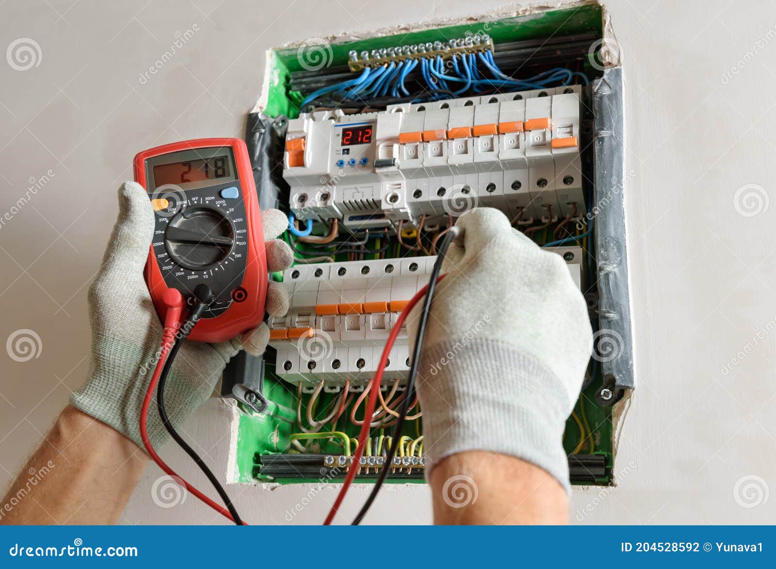 A Worker is Checking with a Multimeter the Correctness of the ...