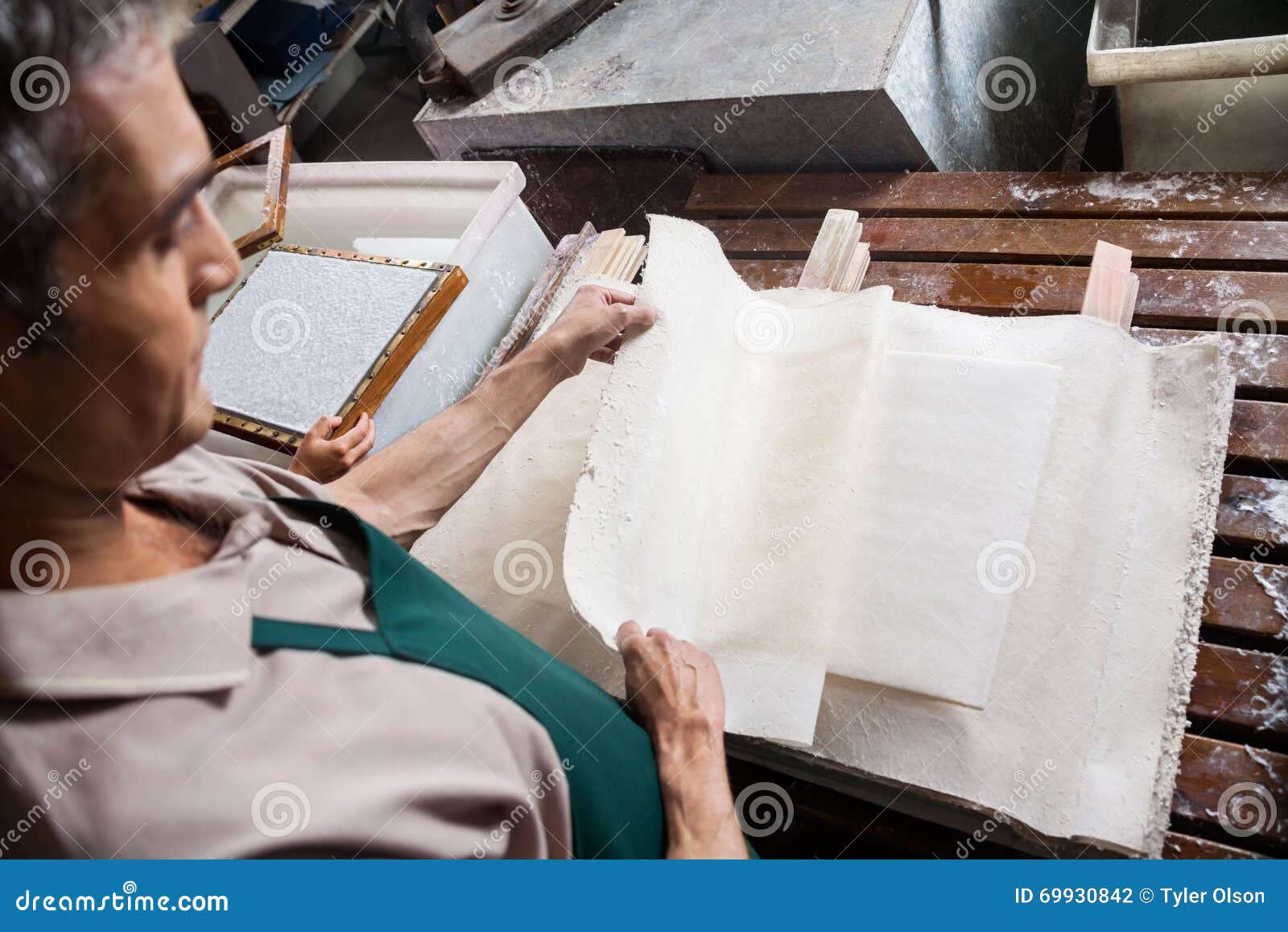Worker Checking Paper Sheets at Table in Factory Stock Photo - Image of ...