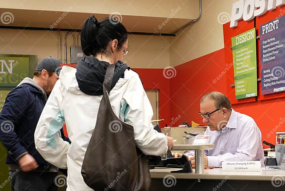 Worker Checking Parcel for Customer at Post Office Editorial Stock ...