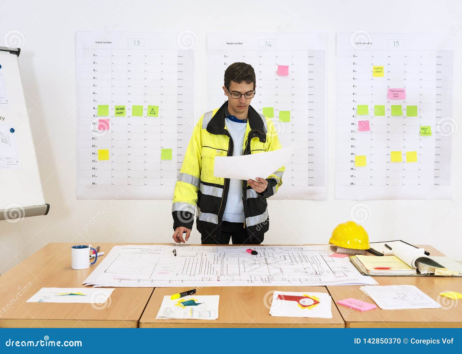 Worker Checking Technical Drawings Stock Photo - Image of note ...