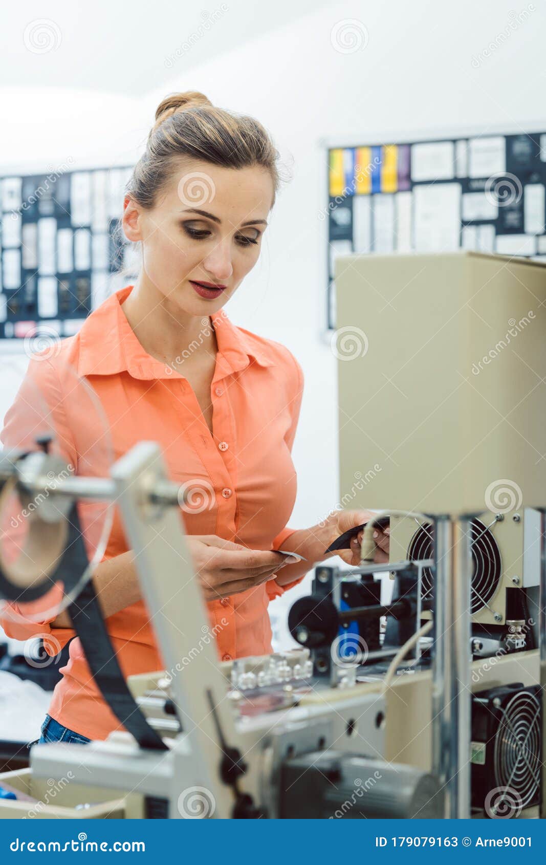 Worker Checking Textile Label Fresh from the Printing Machine Stock ...