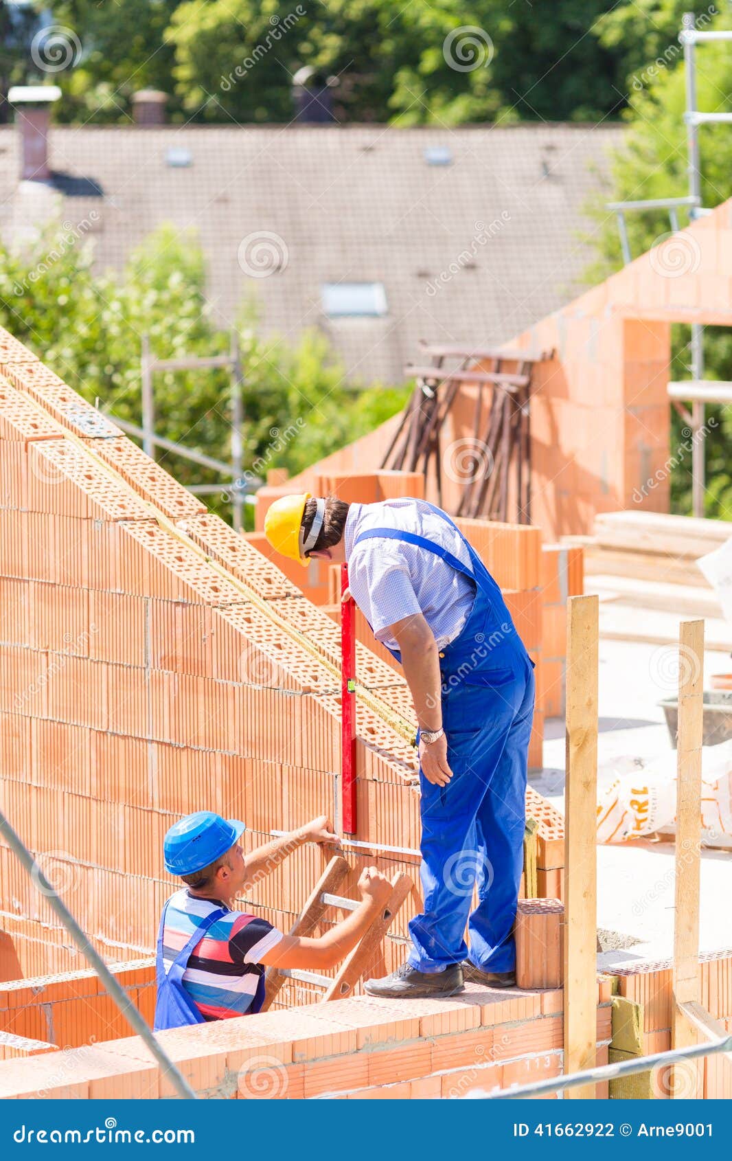 Worker Checking Walls on Construction Site Stock Photo - Image of ...