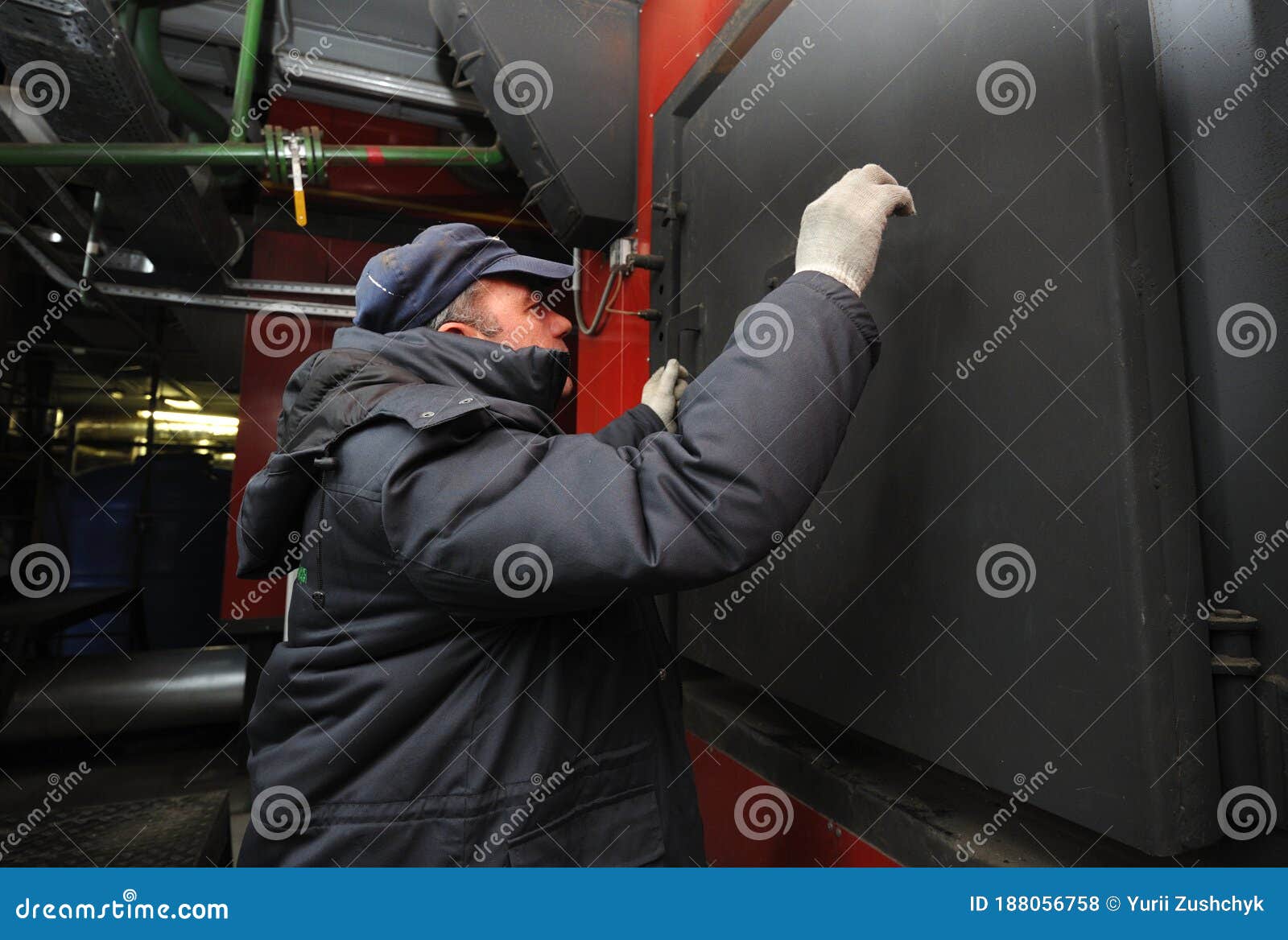 Worker Checking Work of the Steam Generation Vessel of the Boiler-house ...