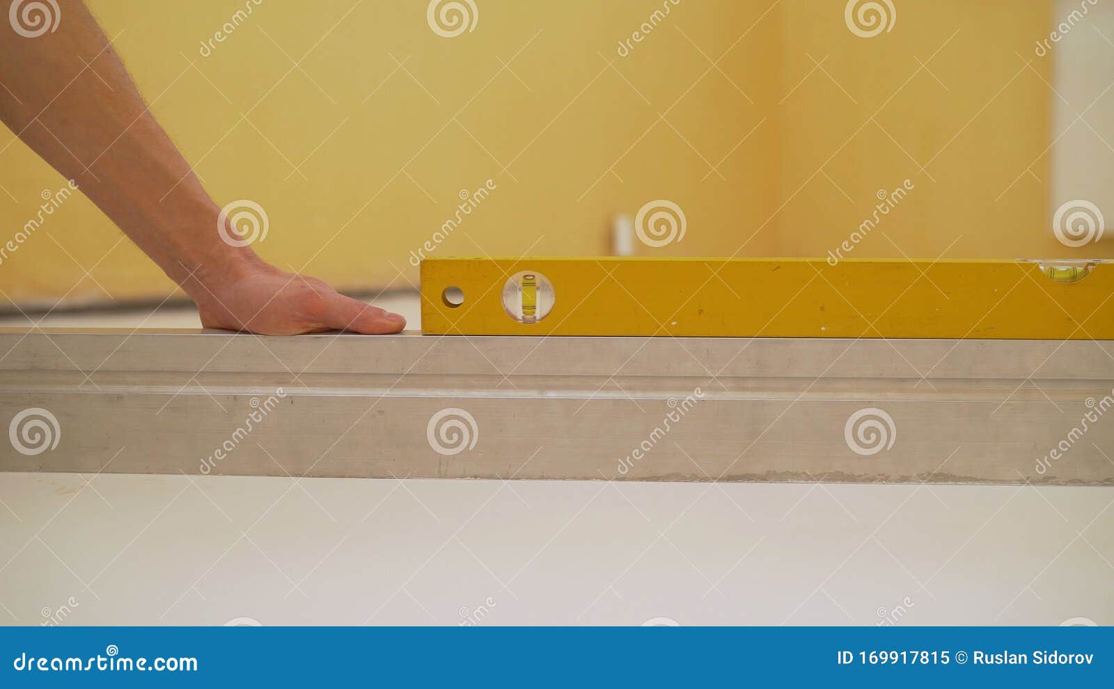 Smooth White Floor Test Tool. a Worker Checks the Floor Level Using a ...