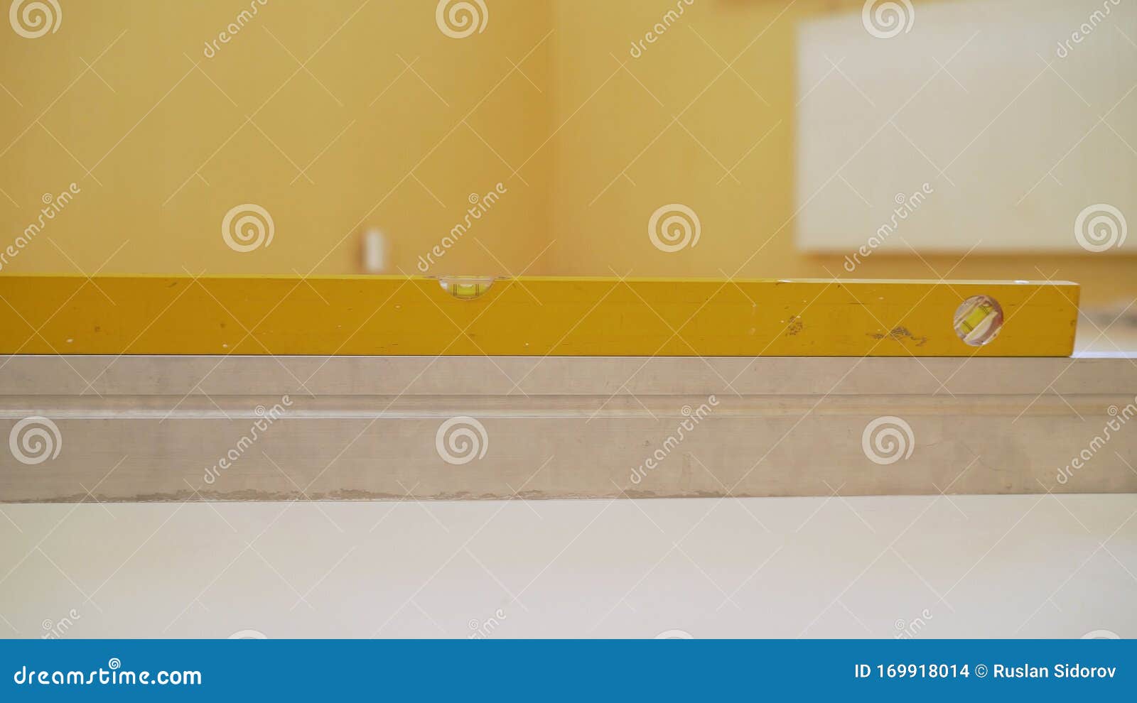 Smooth White Floor Test Tool. a Worker Checks the Floor Level Using a ...