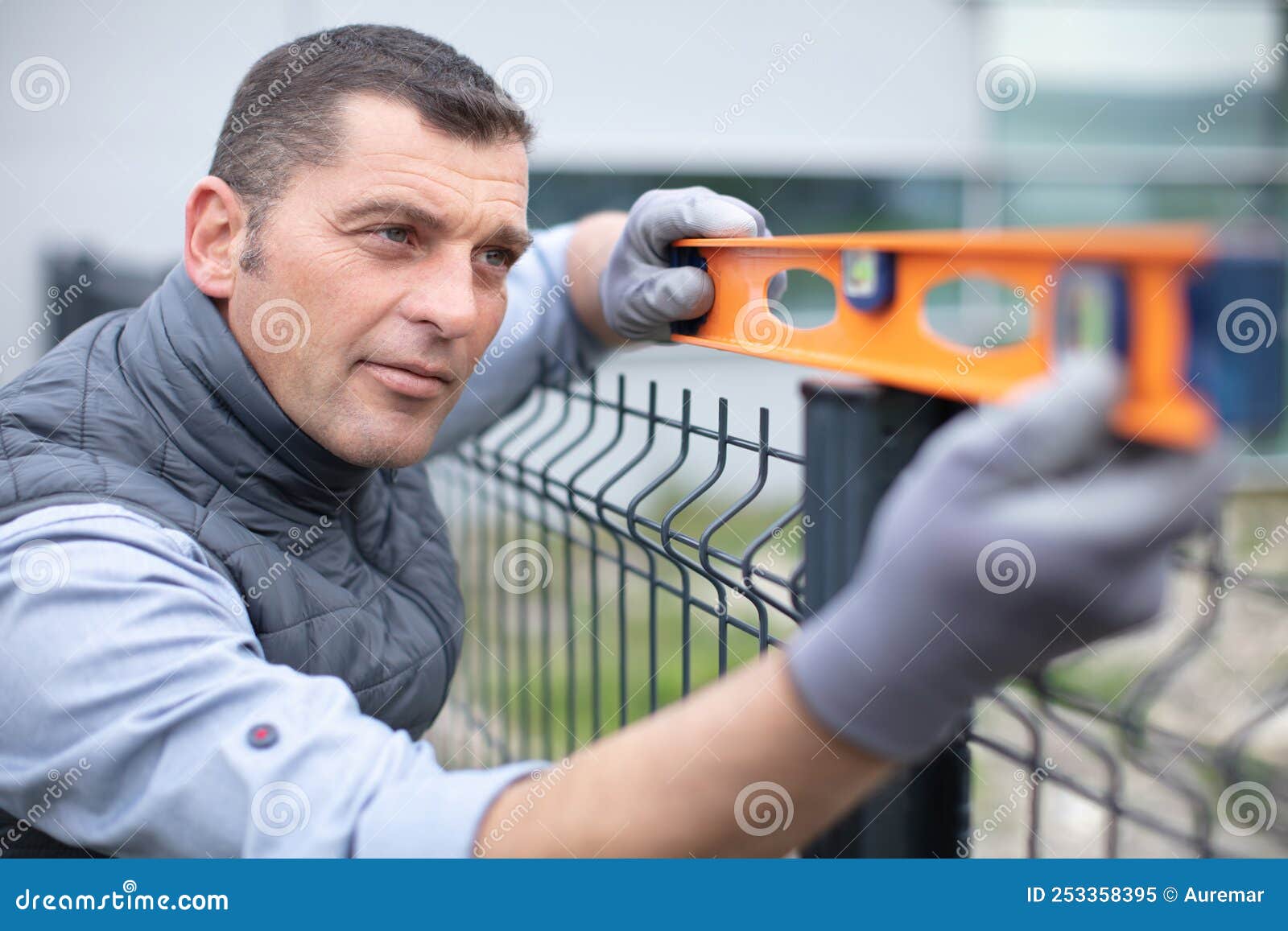Worker Checks Level Metal Fence Stock Image - Image of barrier ... Worker Checks Level Metal Fence Stock Image - Image of barrier ...