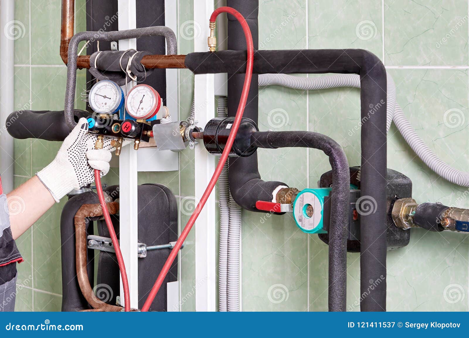 A Worker Checks the Operation of the Heating System. Stock Image ...