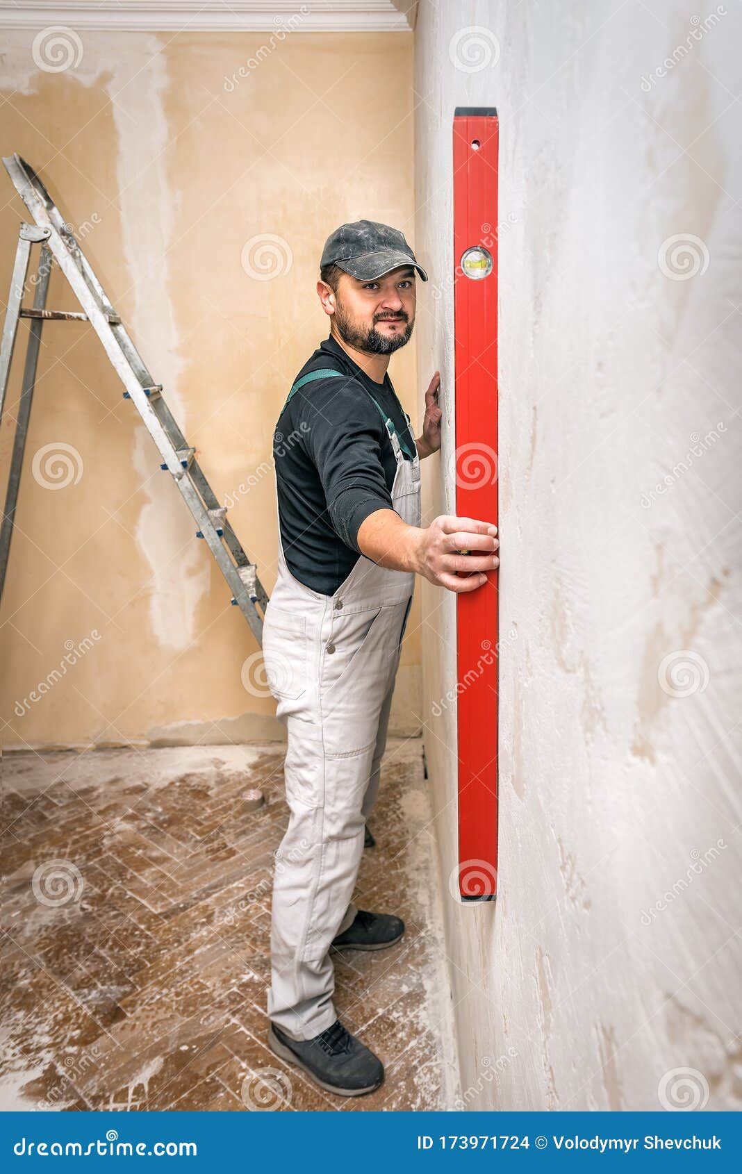 The Worker Checks the Wall Level Stock Photo - Image of check, measure ...