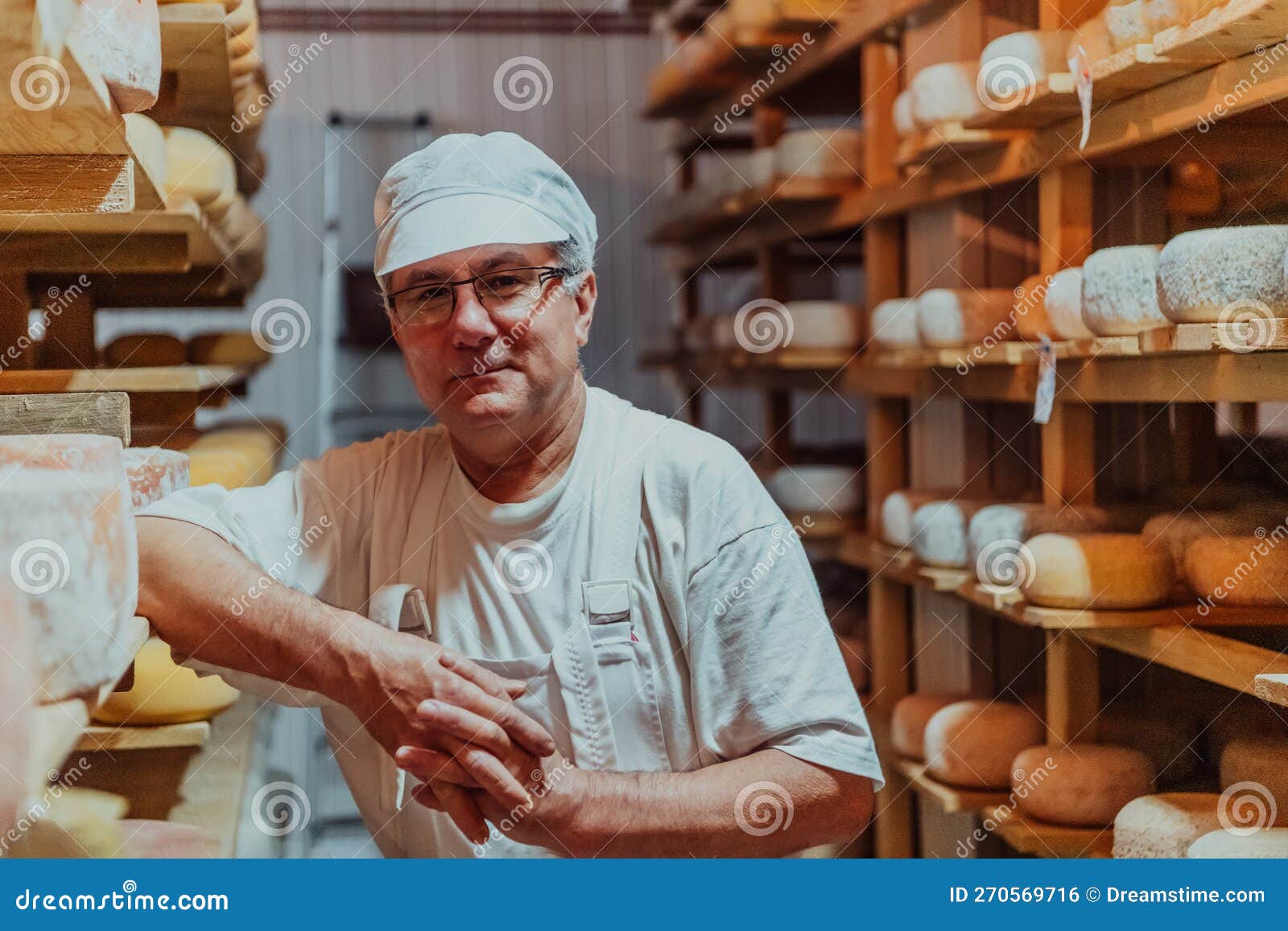 A Worker at a Cheese Factory Sorting Freshly Processed Cheese on Drying ...