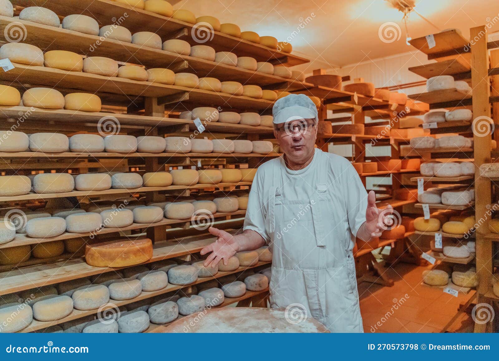 A Worker at a Cheese Factory Sorting Freshly Processed Cheese on Drying ...