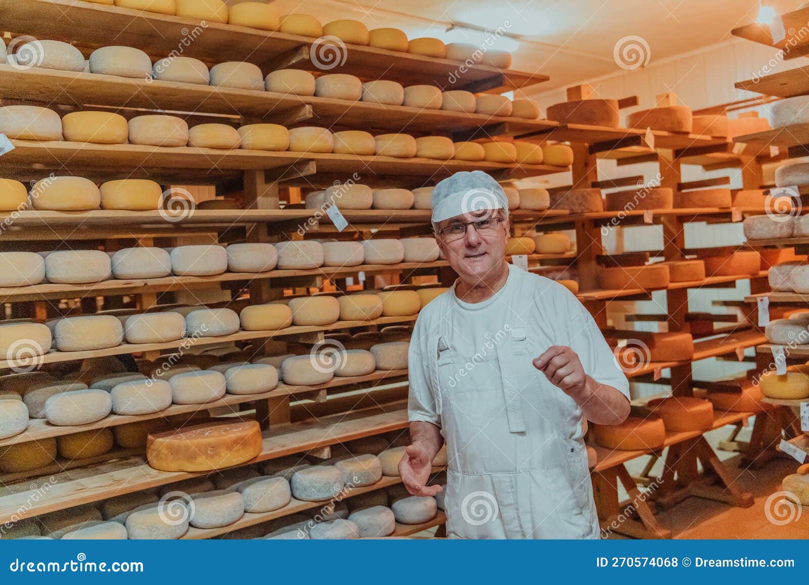 A Worker at a Cheese Factory Sorting Freshly Processed Cheese on Drying ...