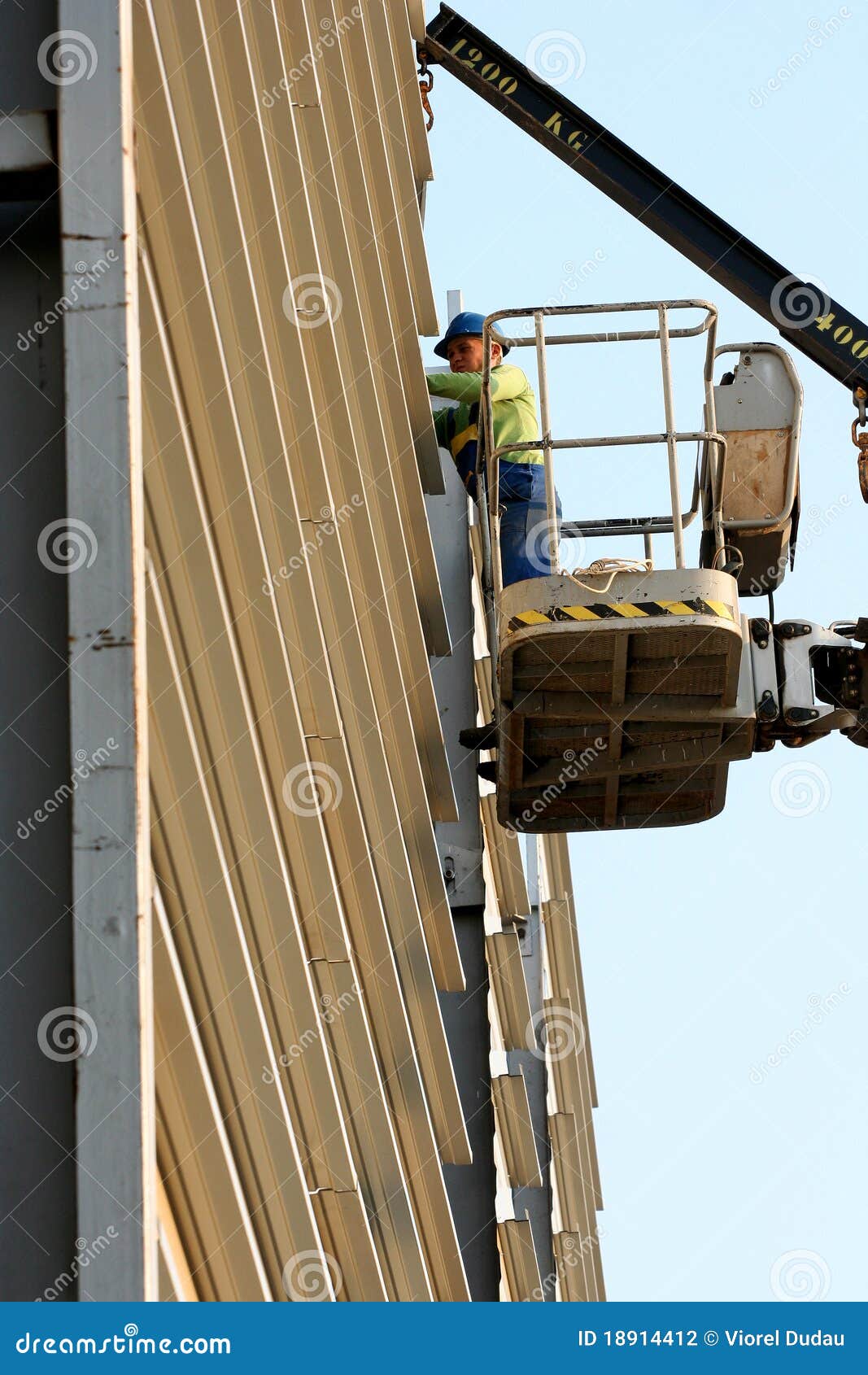Worker on Cherry Picker in Construction Site Editorial Photography ...