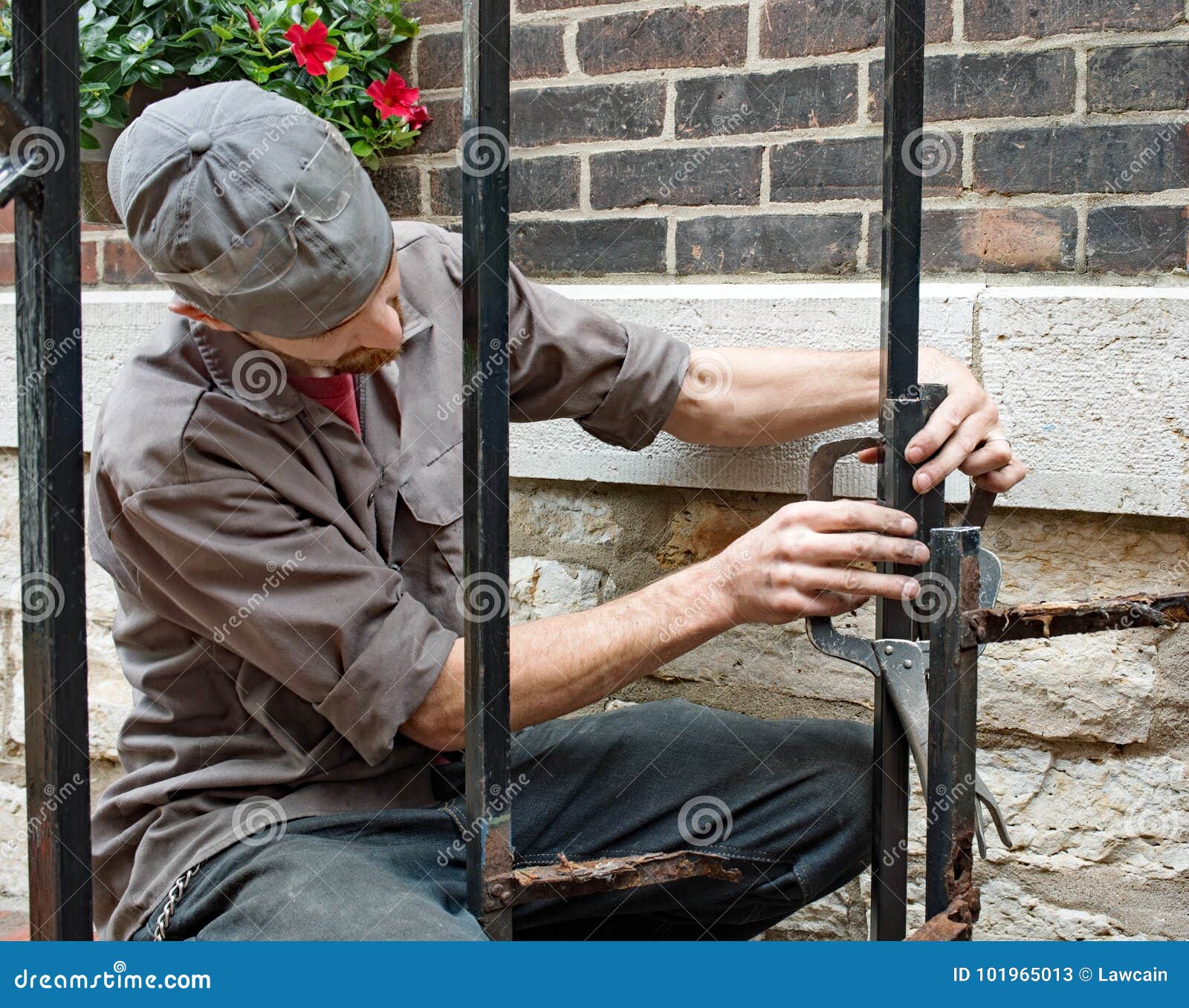 Worker Clamping Metal Post stock image. Image of foundation - 101965013