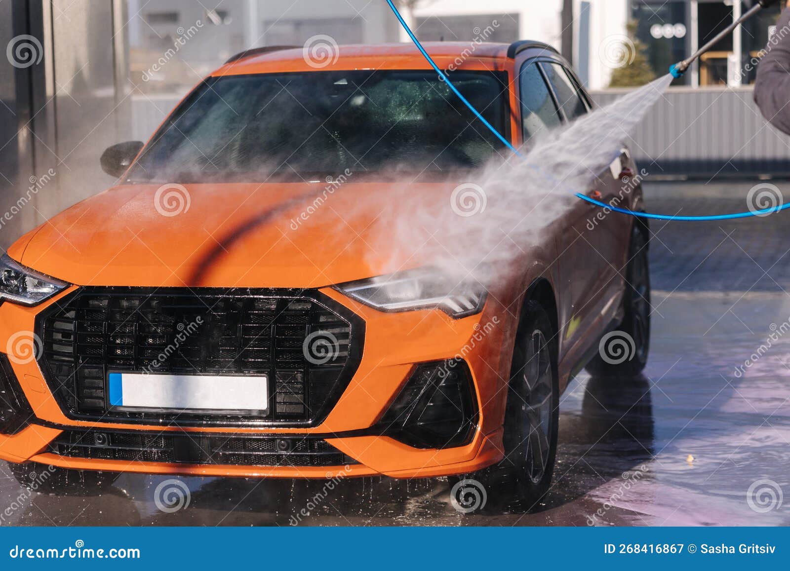 Worker Cleaning Car Using High Pressure Water. Self Servise Car Washing ...