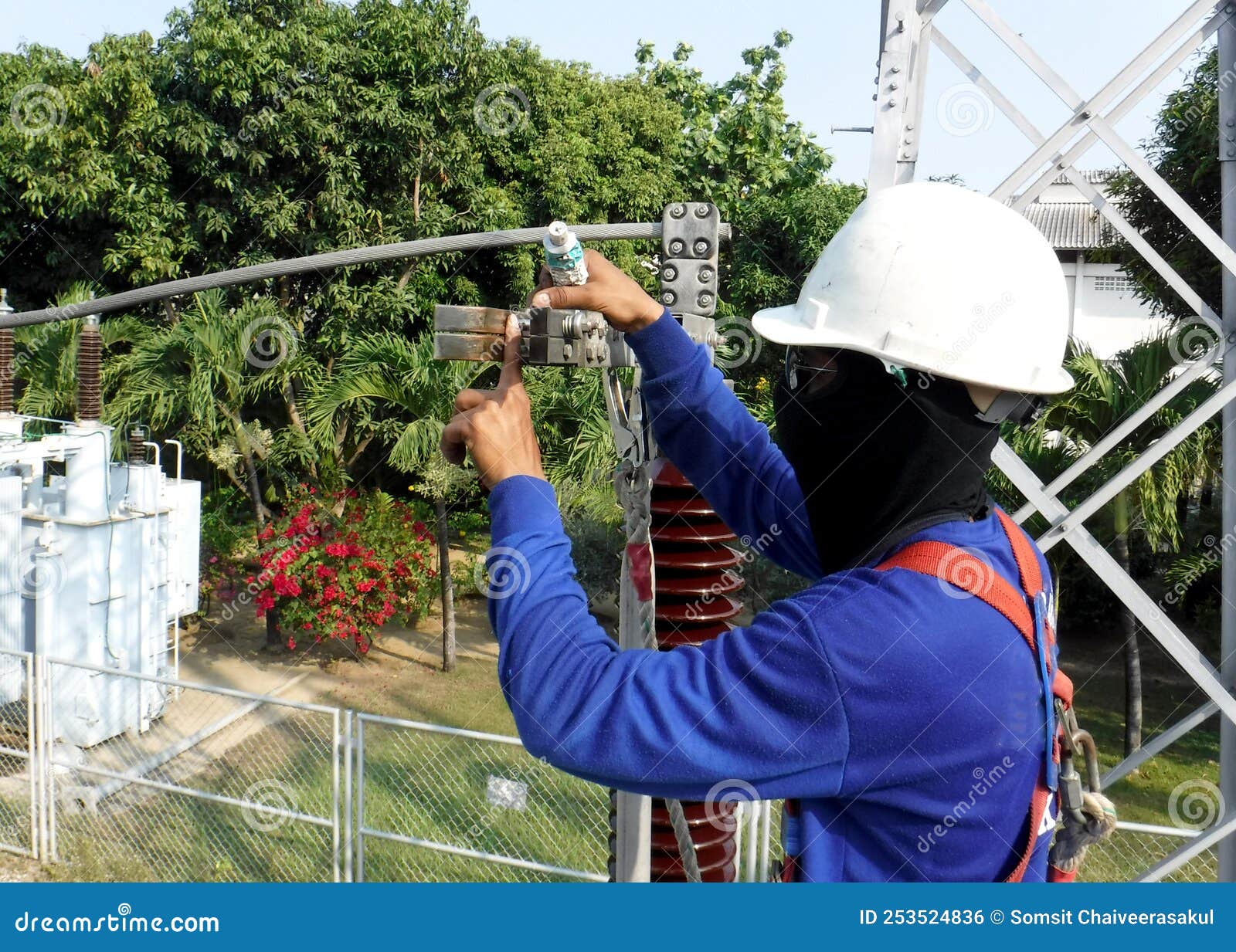 Worker Cleaning the Contact of Disconnecting Switch at Located Take-off ...