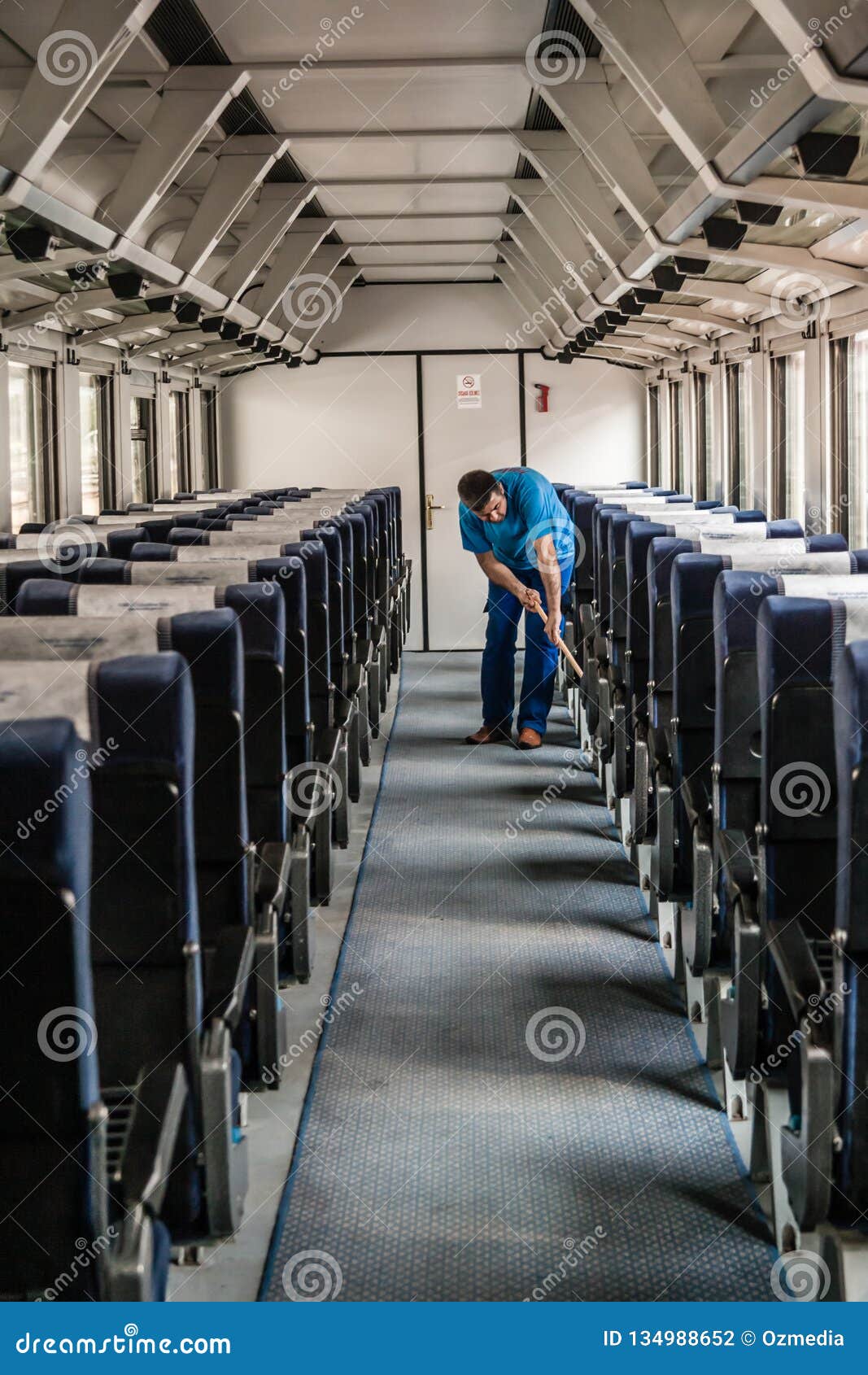 Worker Cleaning the Interior of Intercity Passenger Train Editorial ...