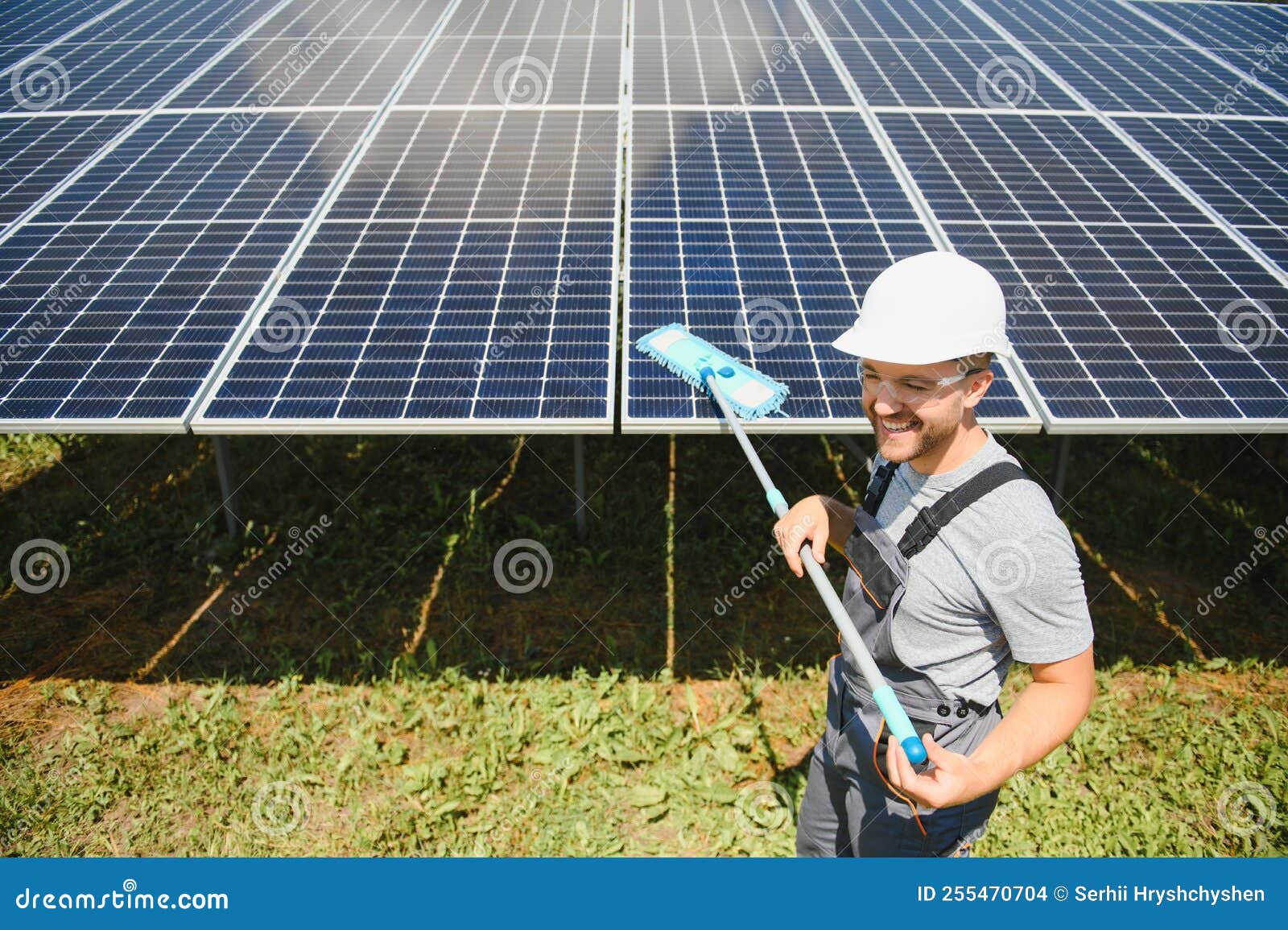 Worker Cleaning Solar Panels after Installation Outdoors Stock Photo ...