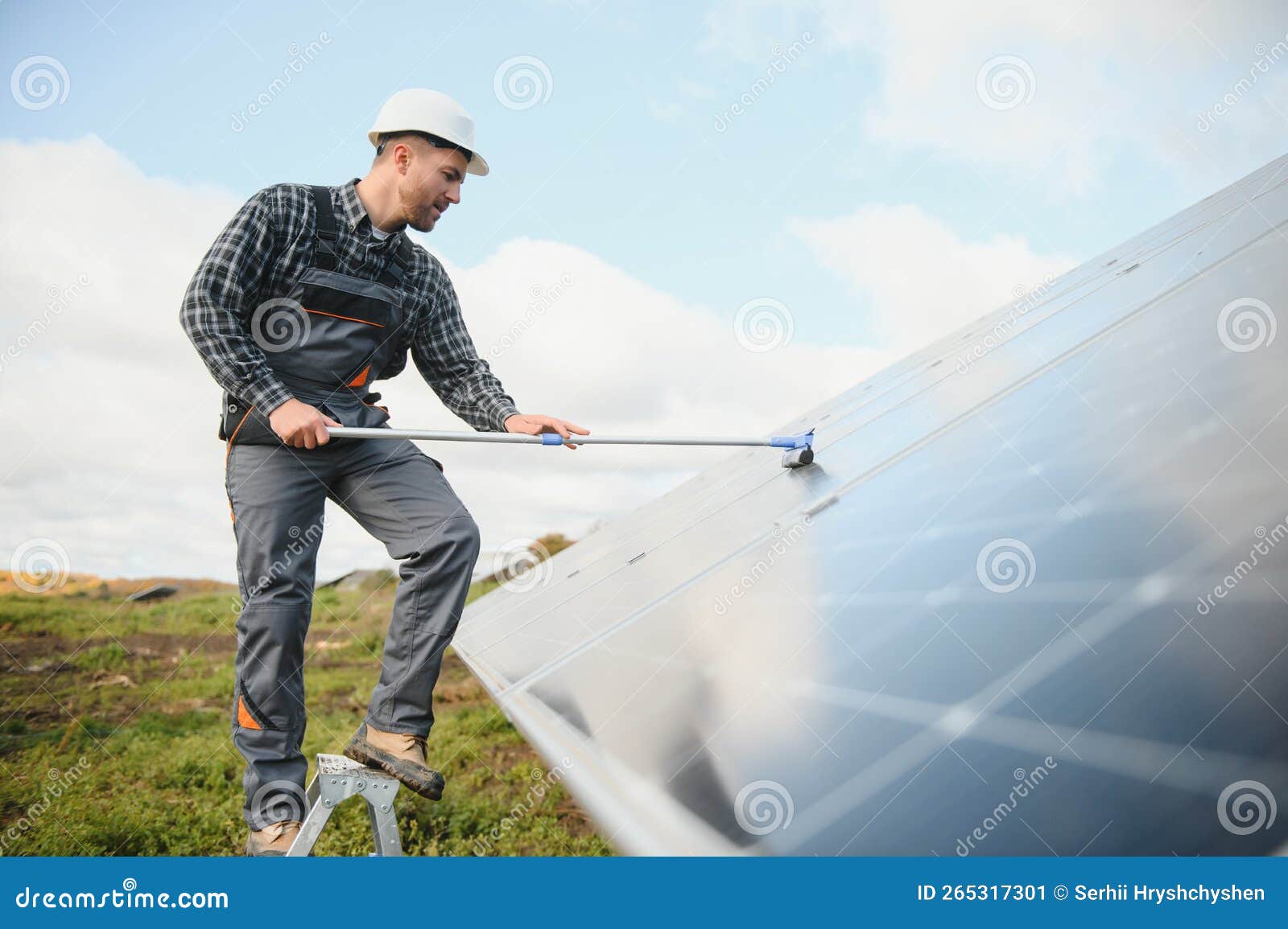Worker Cleaning Solar Panels after Installation Outdoors Stock Image ...