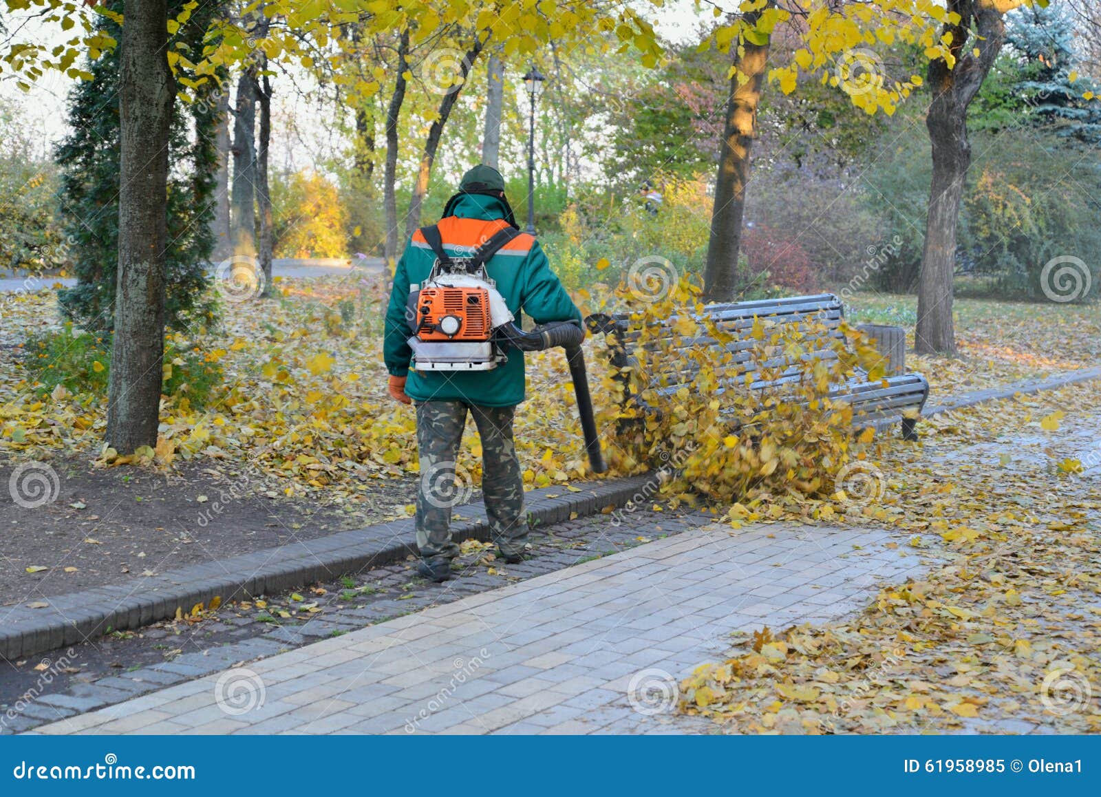 Worker is Cleaning Up Fallen Leaves with Backpack Blower Editorial ...