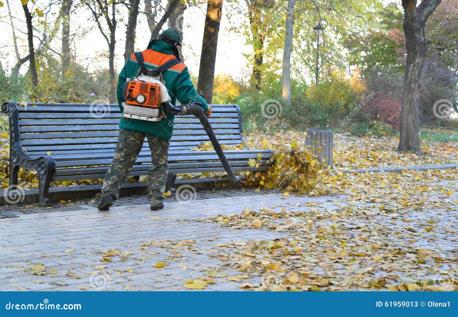 Worker is Cleaning Up Fallen Leaves with Backpack Blower Editorial ...