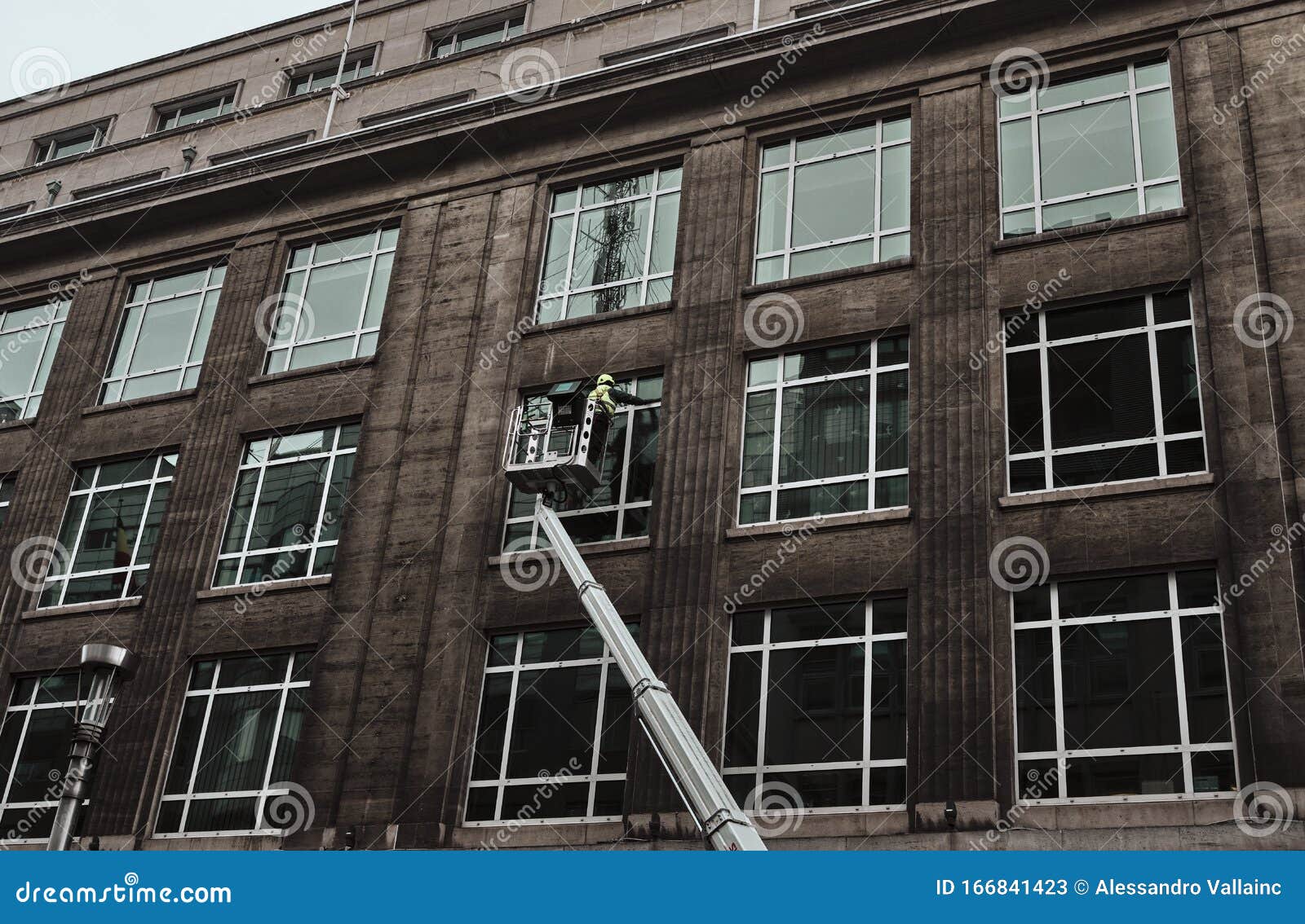 Worker Cleaning the Windows of a Building with a Crane Stock Image ...