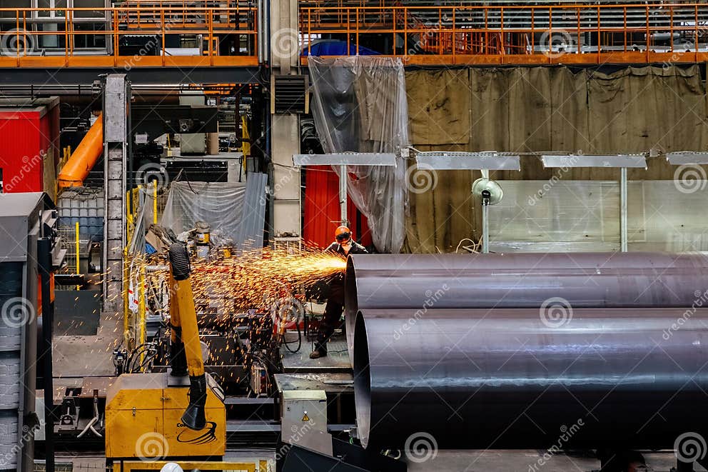 Worker Cleans Welded Seam on Steel Pipe Using Grinding Machine Stock ...