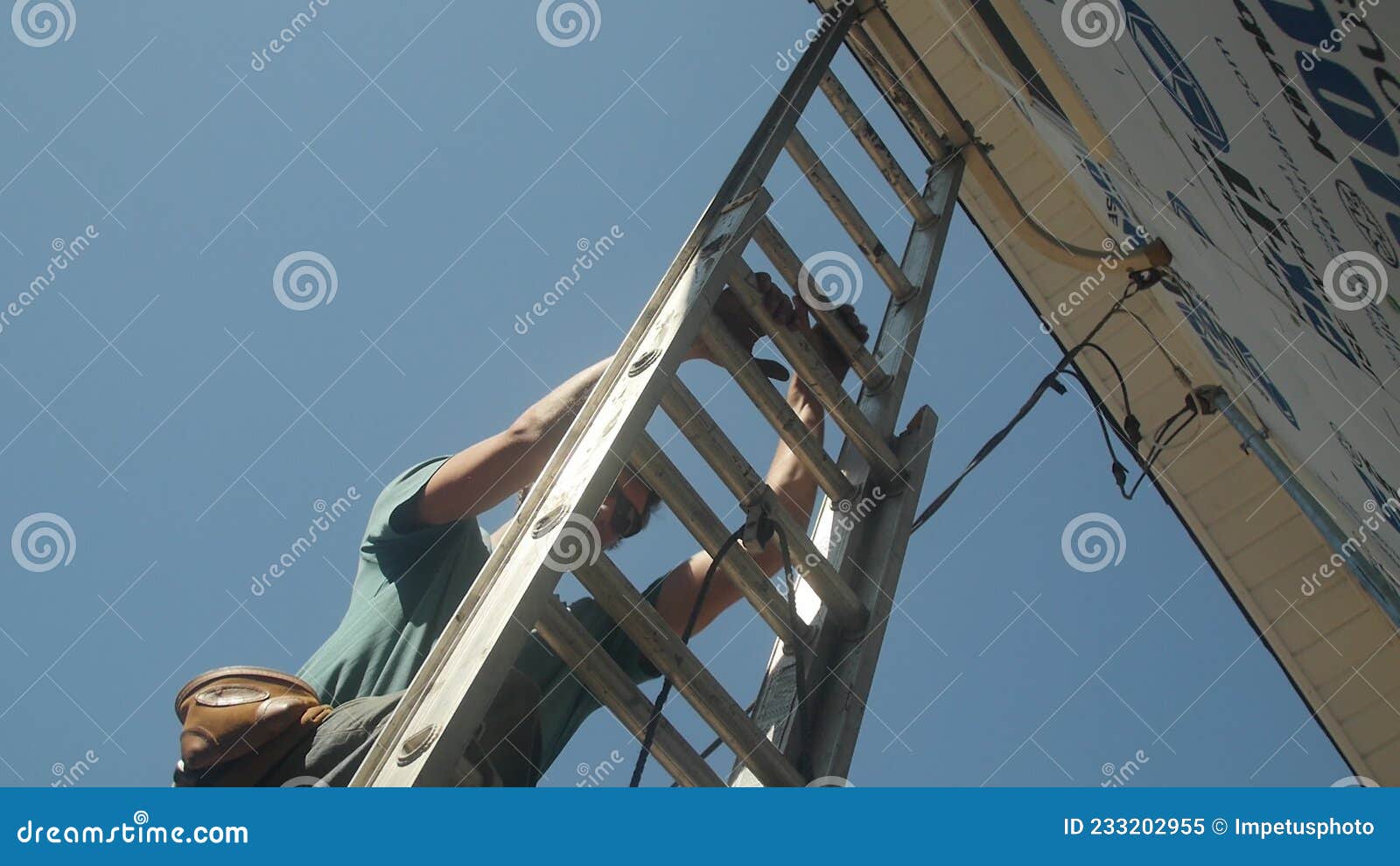 Man climbing down a ladder stock video. Video of build - 233202955