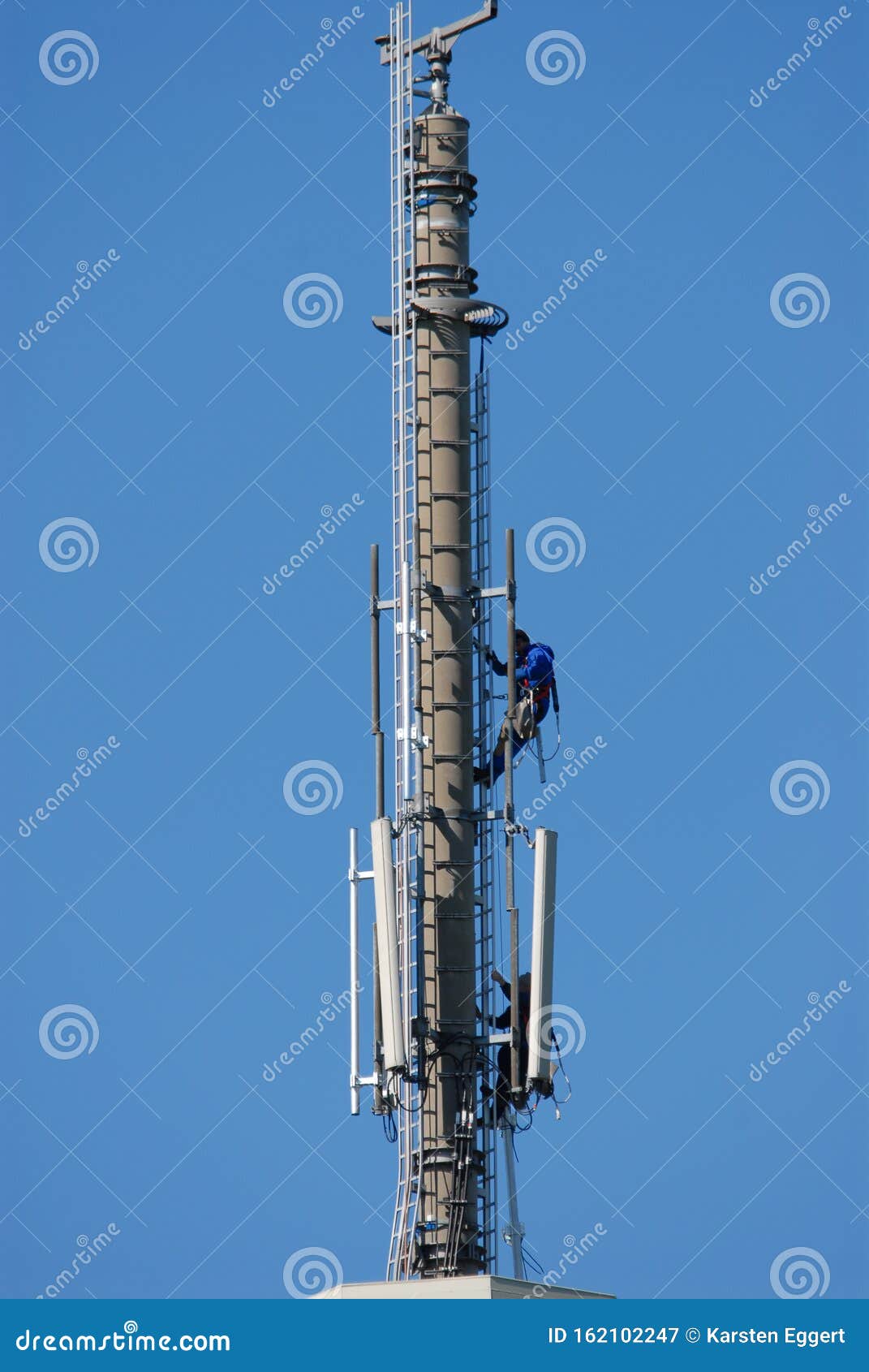 Worker Climbs on a Mobile Phone Mast Stock Image - Image of metal ...