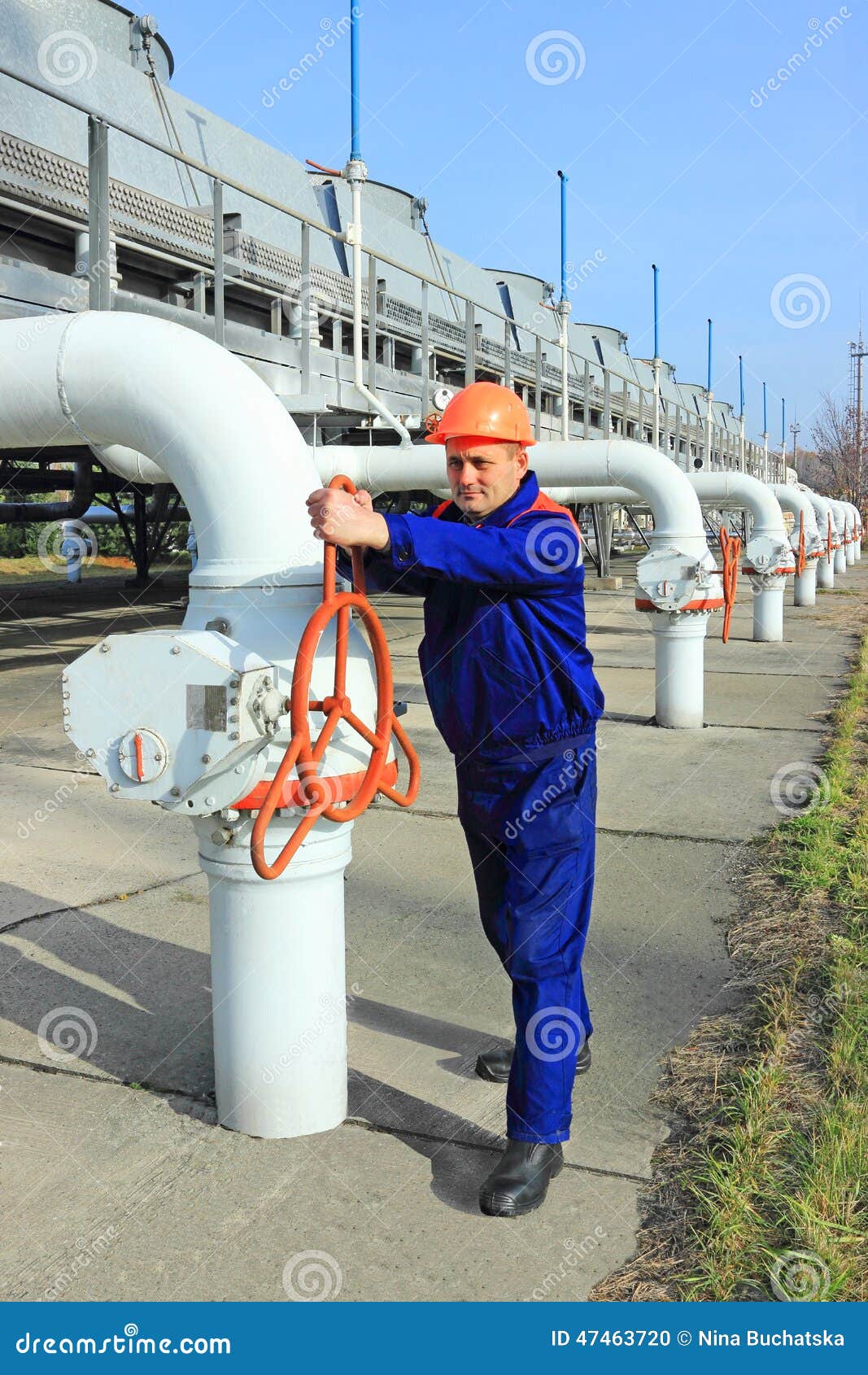 Worker closing valve stock photo. Image of helmet, production - 47463720