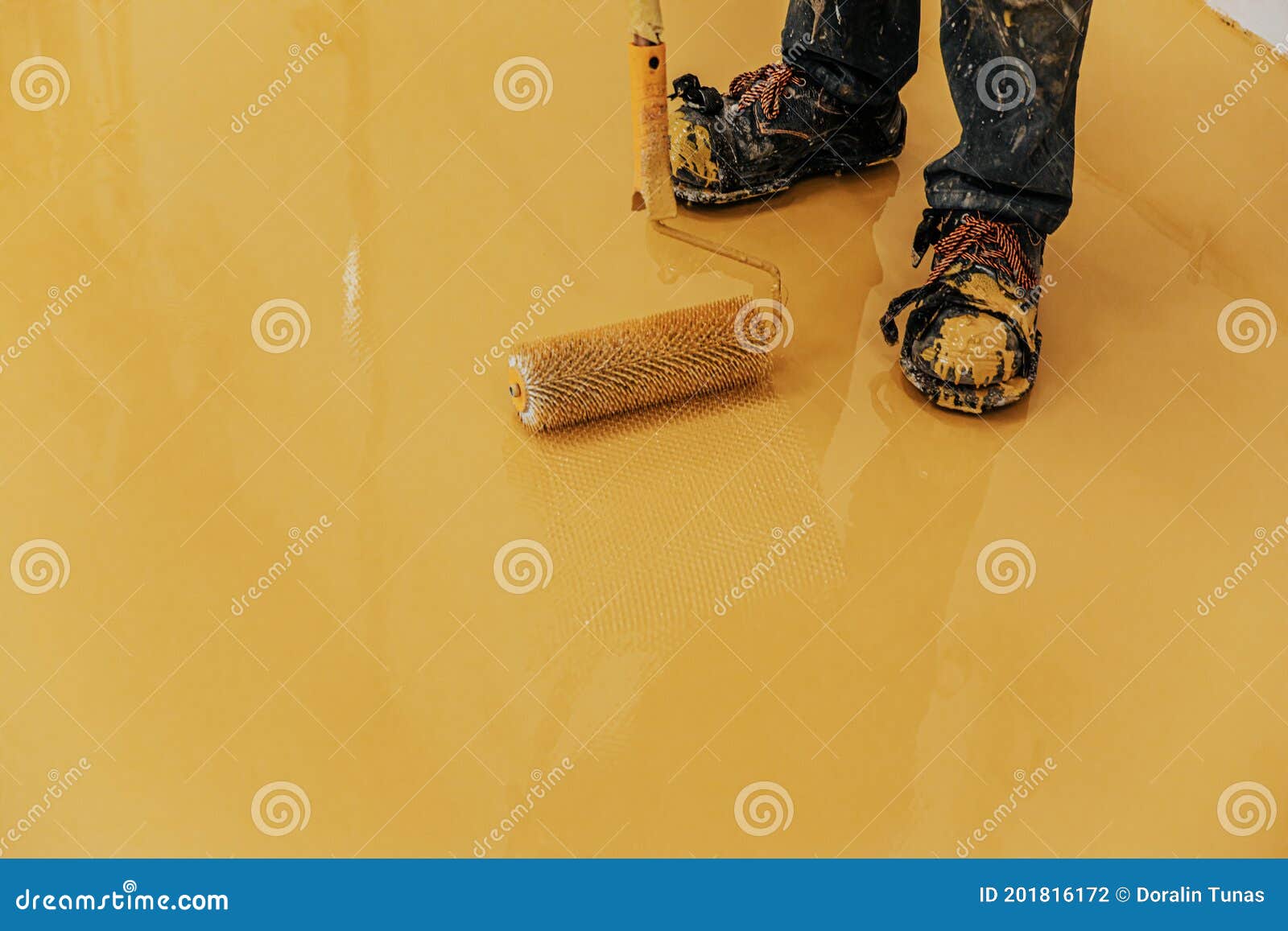A Construction Worker Apply Epoxy Resin in an Industrial Deposit Stock ...