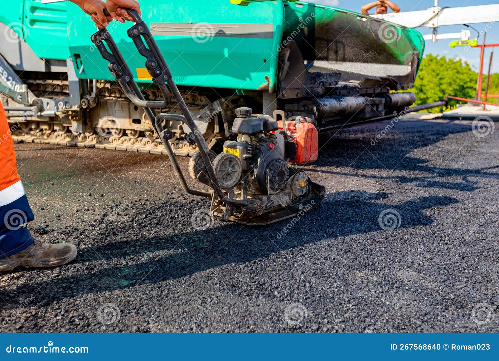 Worker Compacts Tarmac Using Vibration Plate Compactor Stock Photo ...