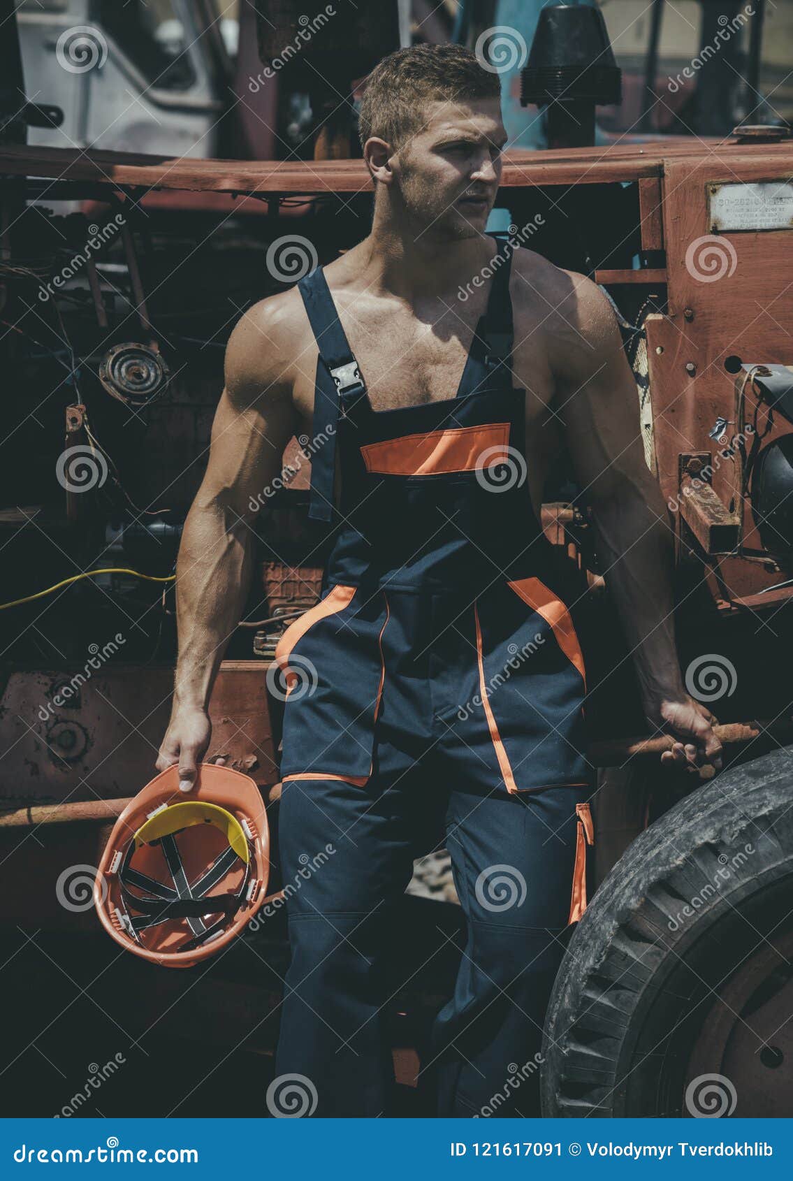 Worker Concept. Strong Worker Rest at Heavy Construction Machine Stock ...