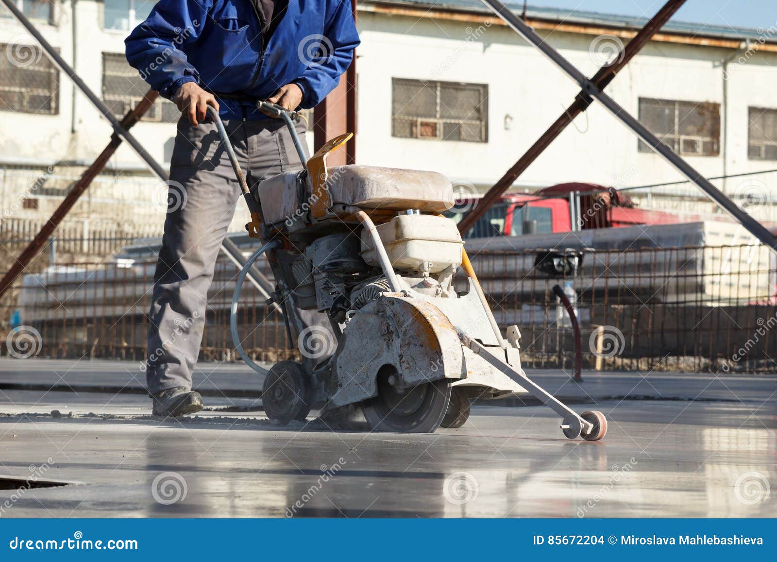 Worker with Concrete Cutting Machine in Motion Stock Photo - Image of ...