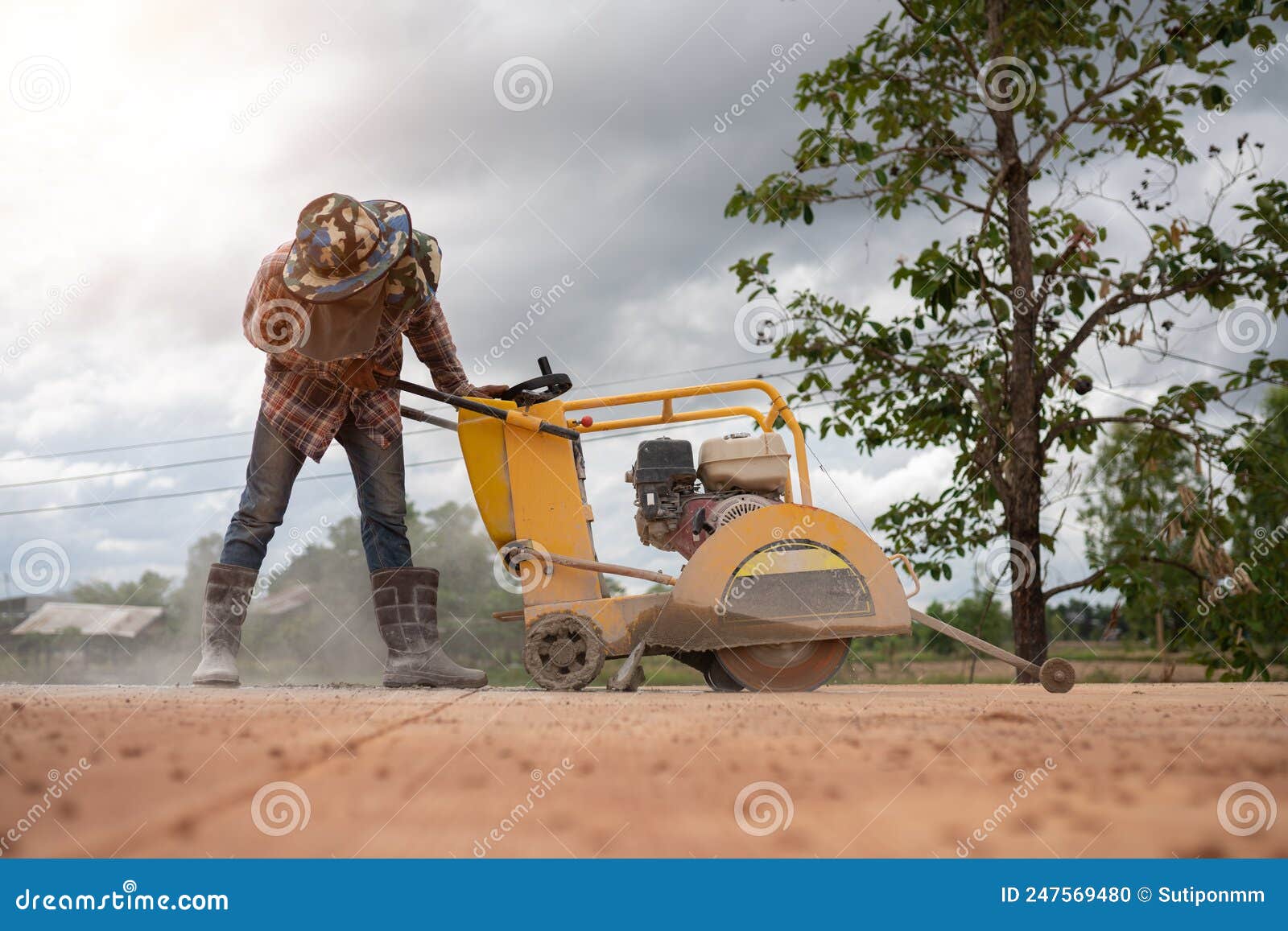 Worker Concrete Cutting in the Road Construction Stock Photo - Image of ...