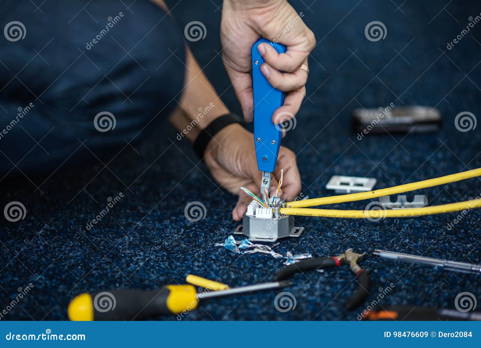Worker Connect A Network Cable With RJ45 Sockets By Punch-down Tool ...