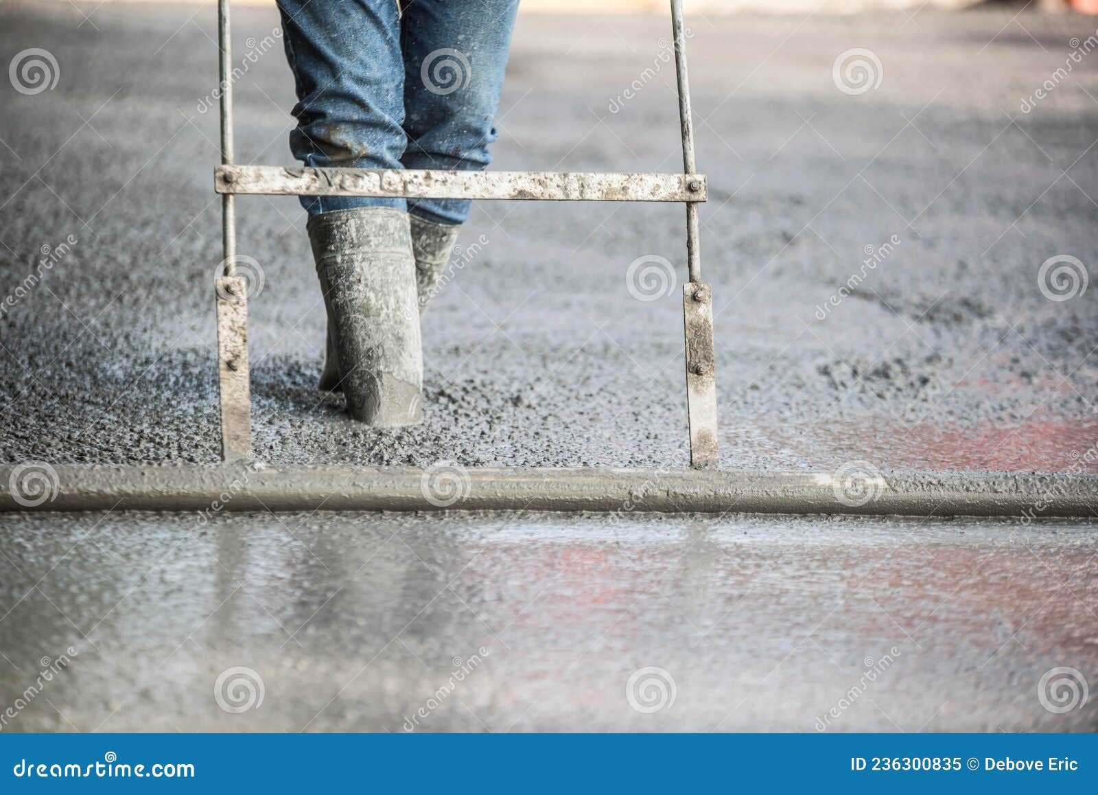 Worker on a Construction Site Laying the Concrete for the Foundations ...