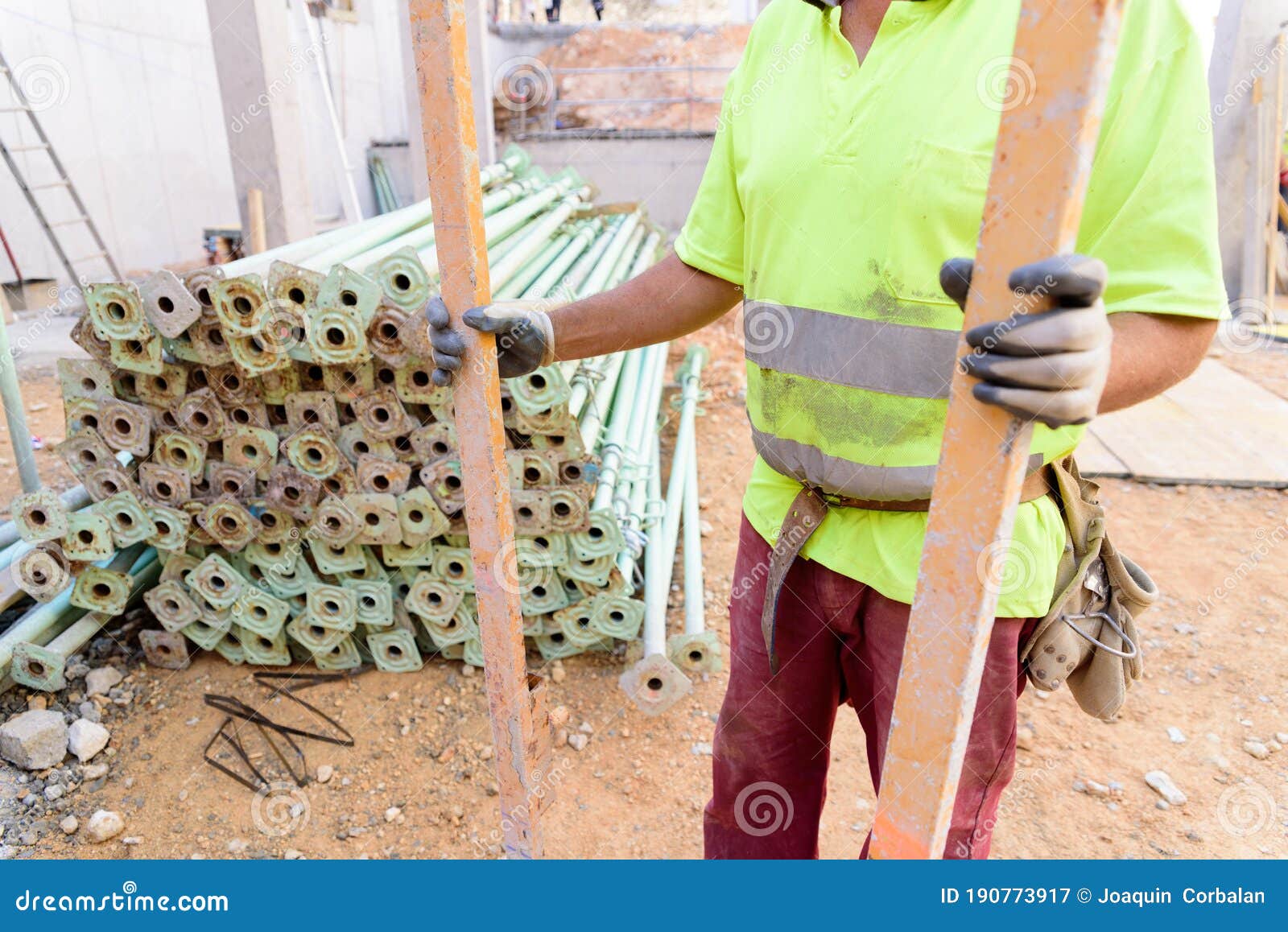 Worker on a Construction Site Cleaning the Area of Rubble and Garbage ...