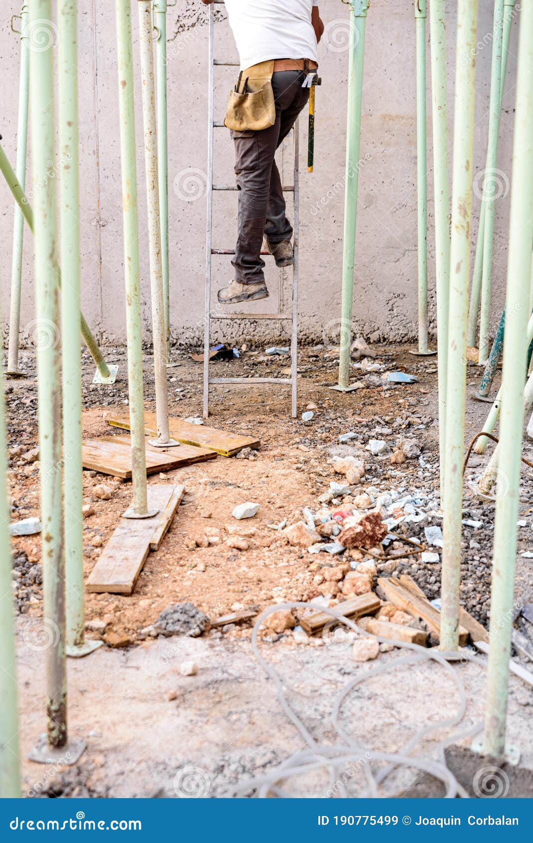 Worker on a Construction Site Cleaning the Area of Rubble and Garbage ...