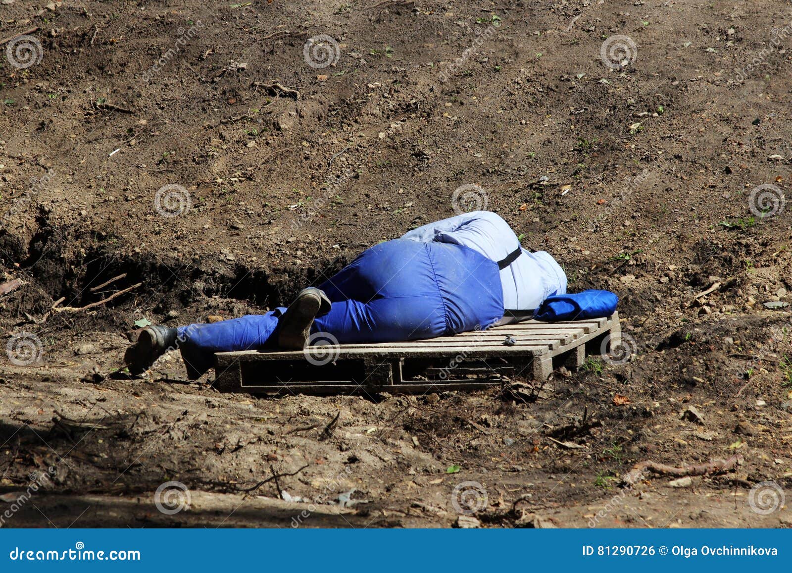 Worker at a Construction Site during Lunch Break Sleeping on Pallet ...