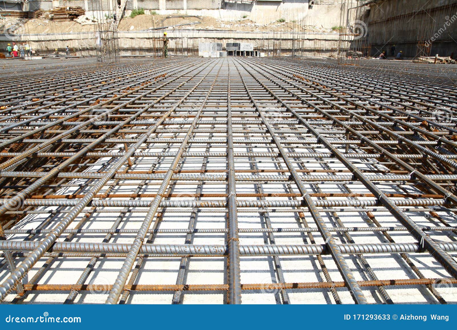 Worker in the Construction Site Making Reinforcement Metal Framework ...